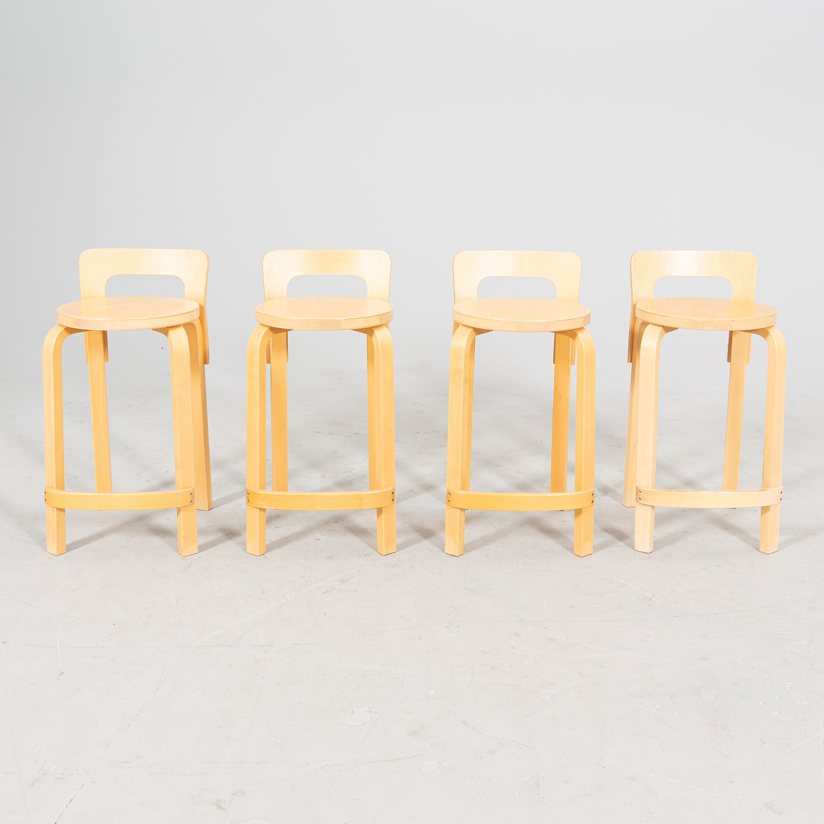 A set of four birch bar stools by Alvar Aalto, modell "K65" Artek, from ...