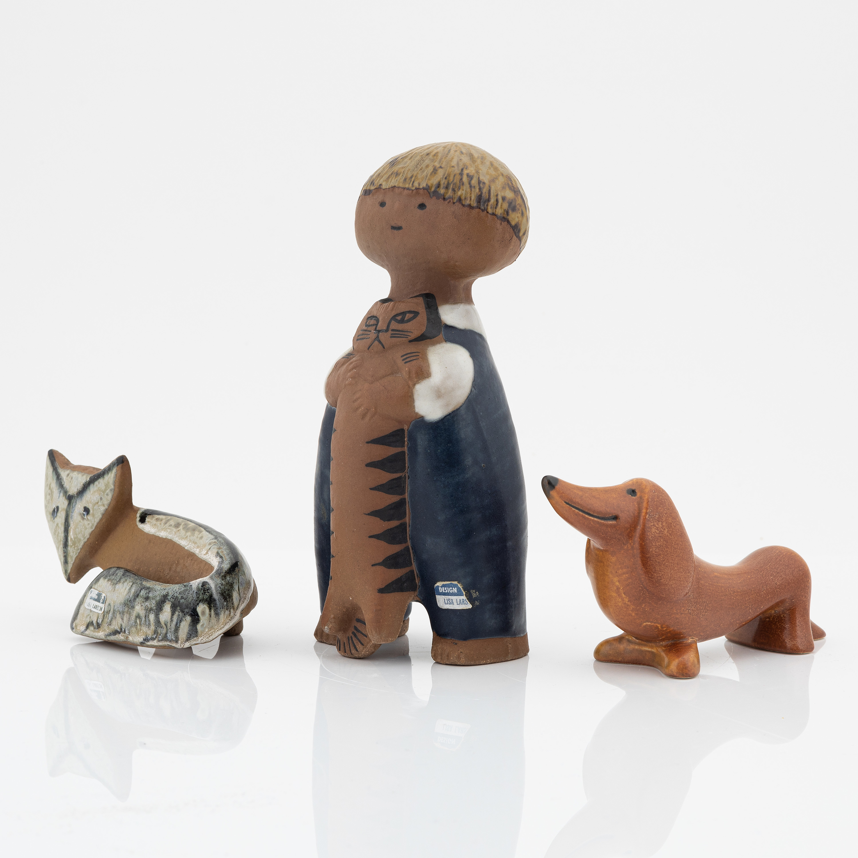 Lisa Larson, three stoneware figurines, Gustavsberg, Sweden. - Bukowskis