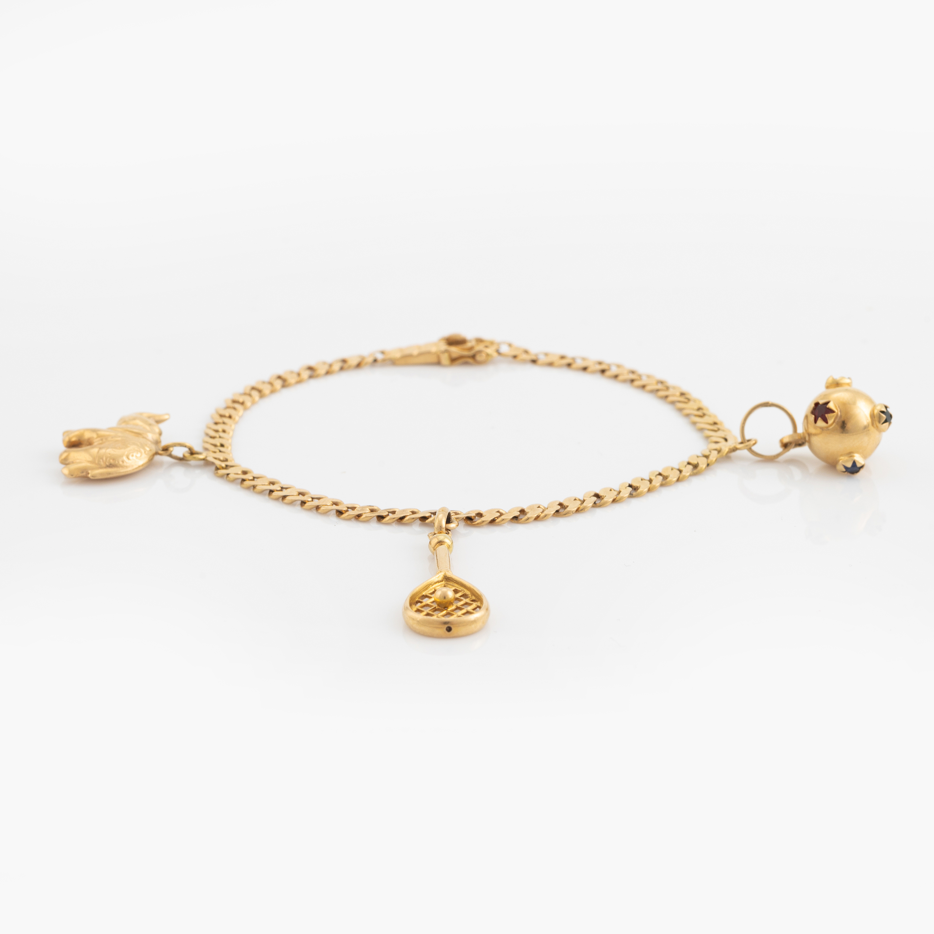 Armband med berlocker, 18K guld. - Bukowskis