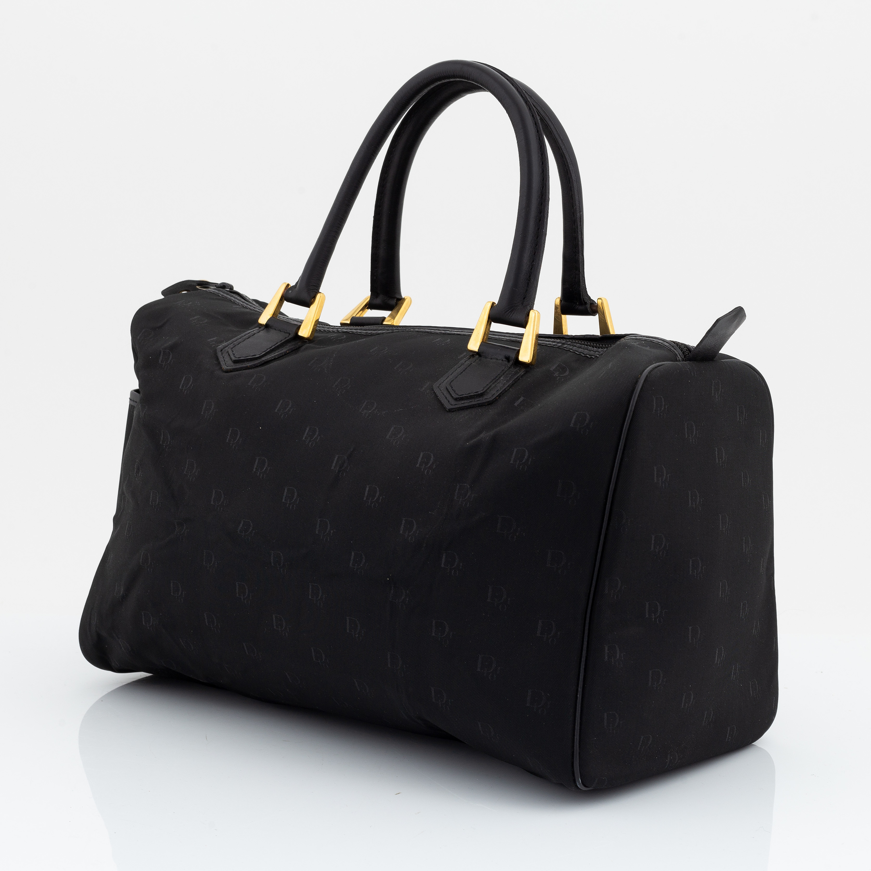 Christian Dior, a black canvas weekend bag. - Bukowskis
