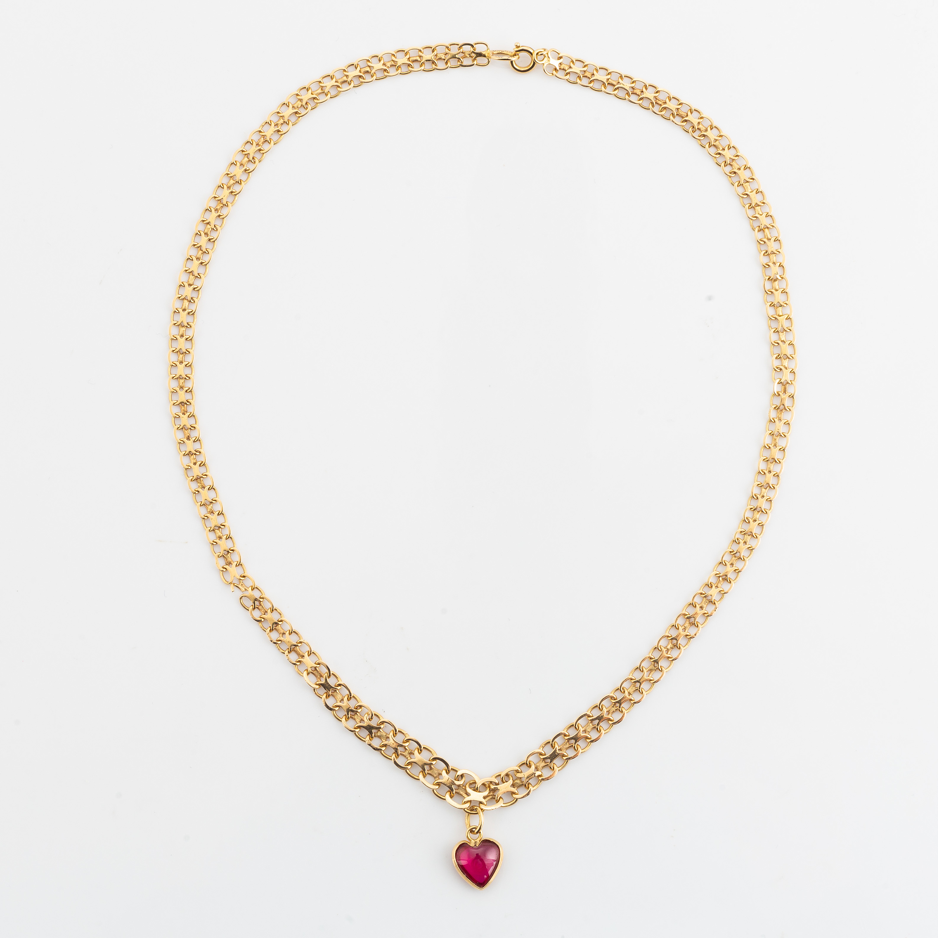 18K gold necklace with synthetic red stone heart charm. - Bukowskis