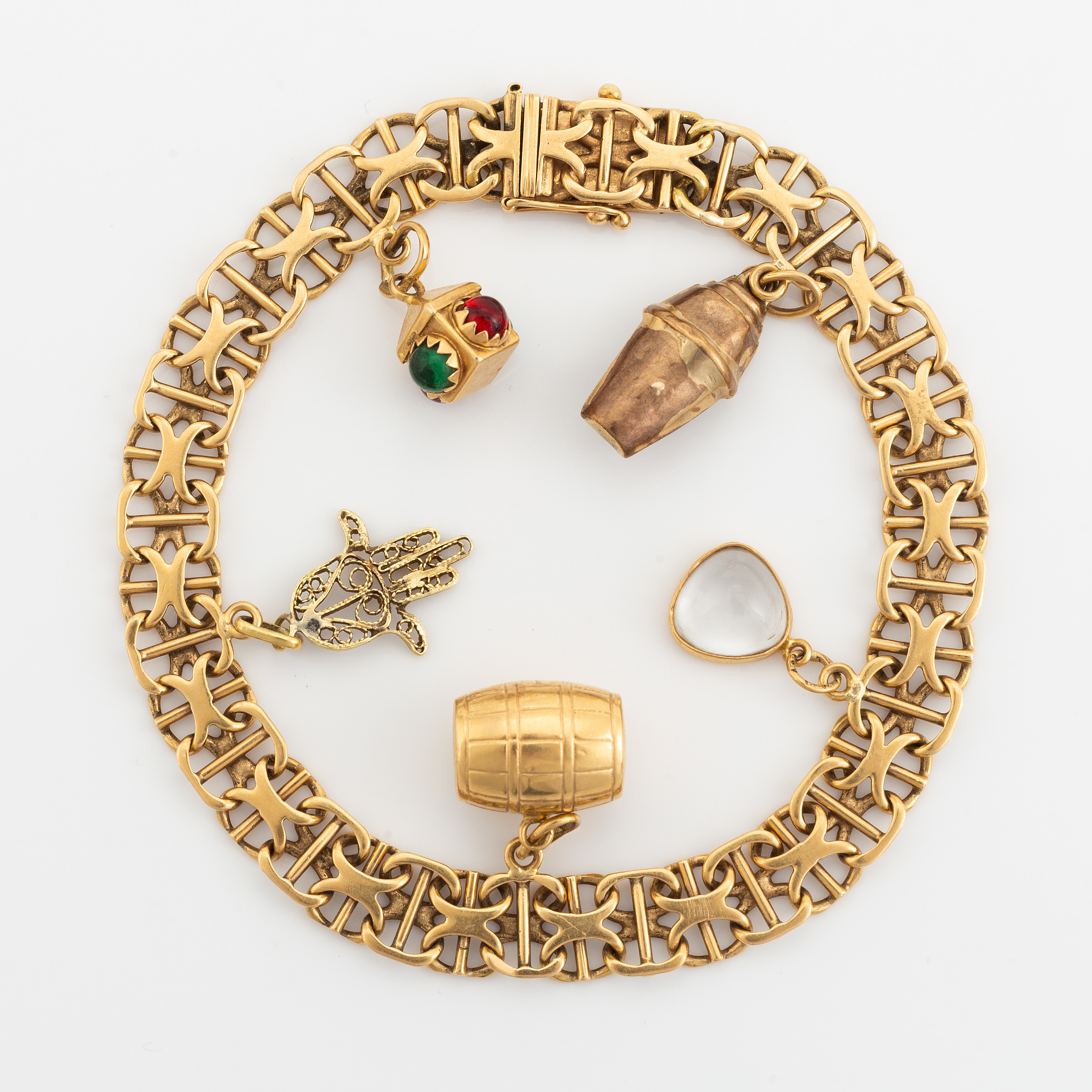 Armband, x-länk, 18K guld, med berlocker. - Bukowskis