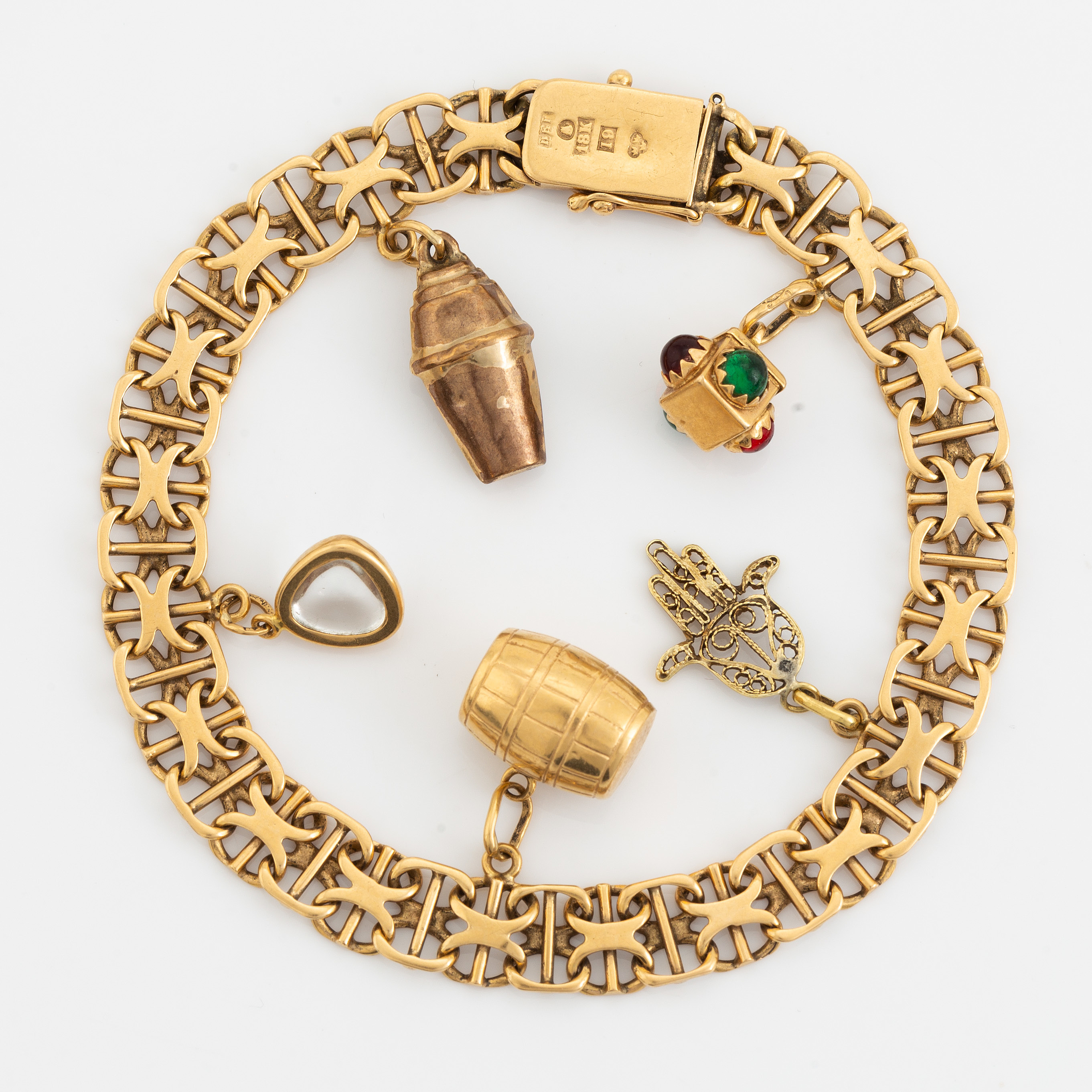 Armband, x-länk, 18K guld, med berlocker. - Bukowskis