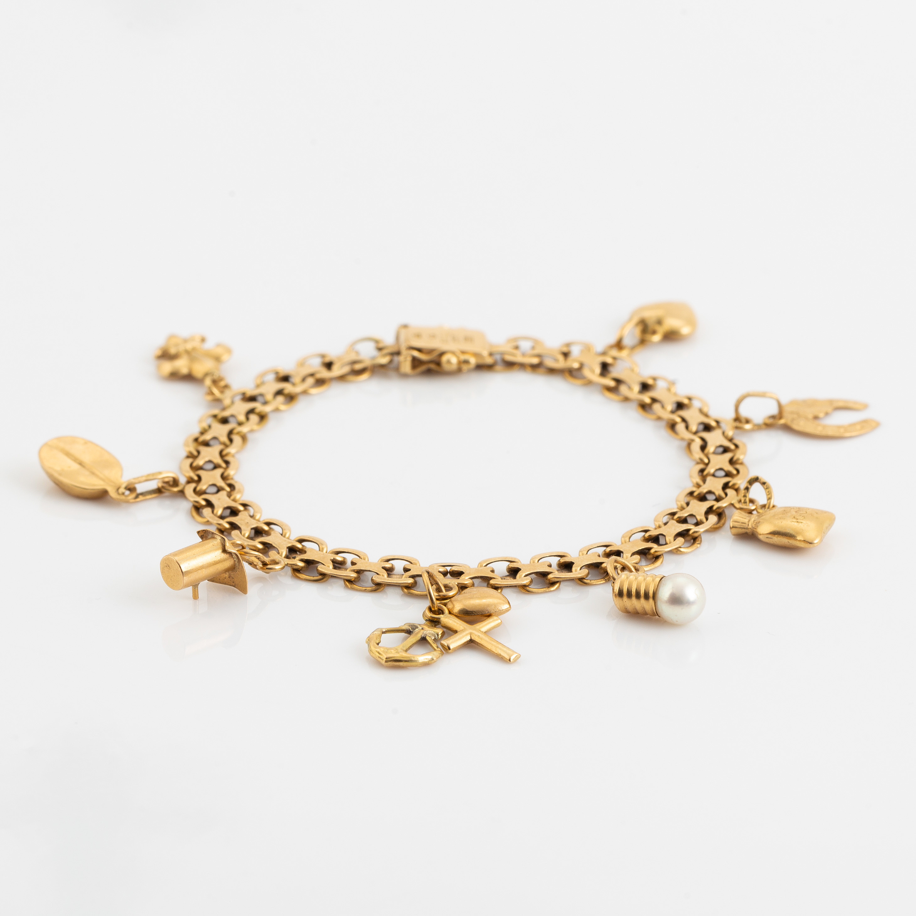 Armband, x-länk, 18K guld, med berlocker. - Bukowskis