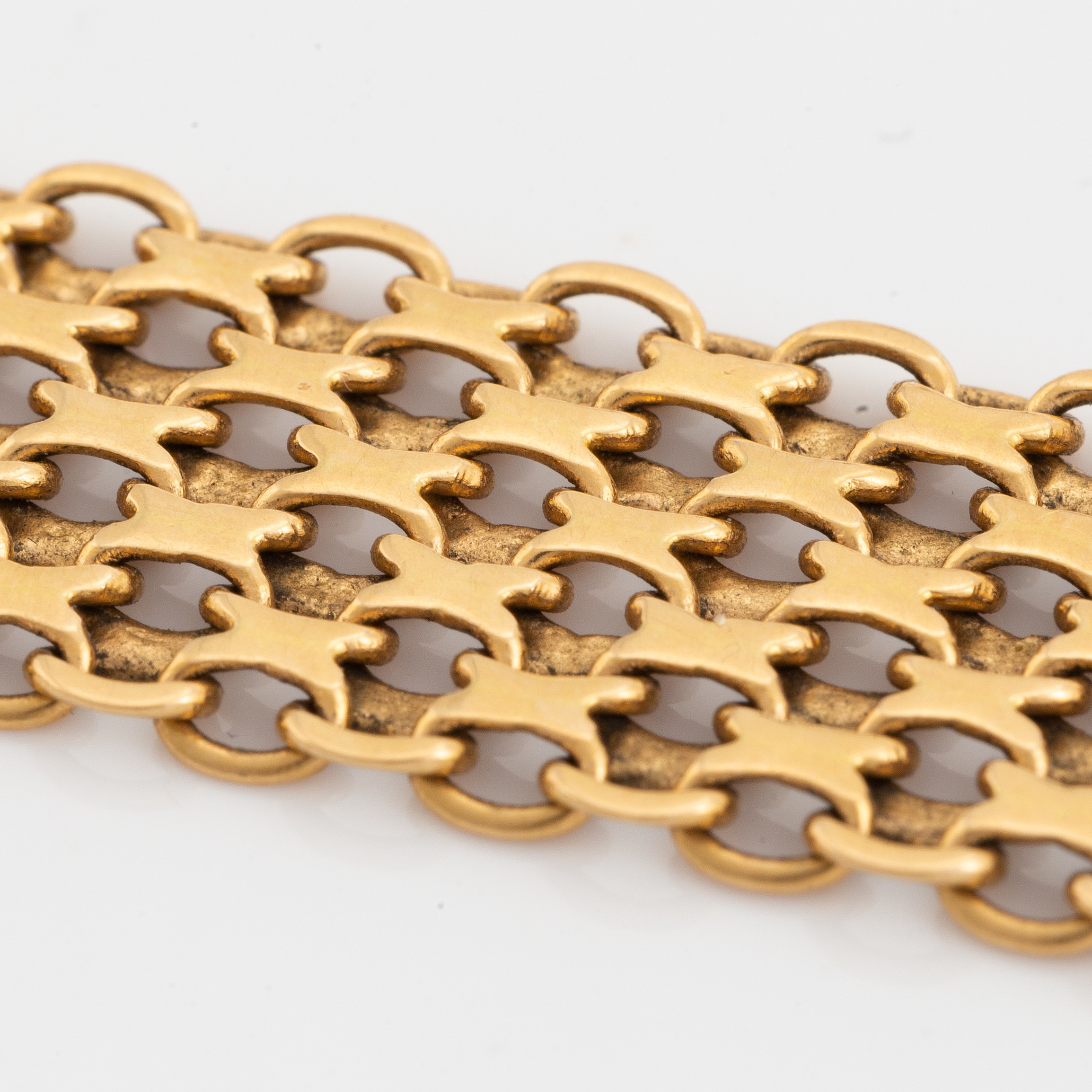 Armband x- länk, 18K guld, med berlock. - Bukowskis