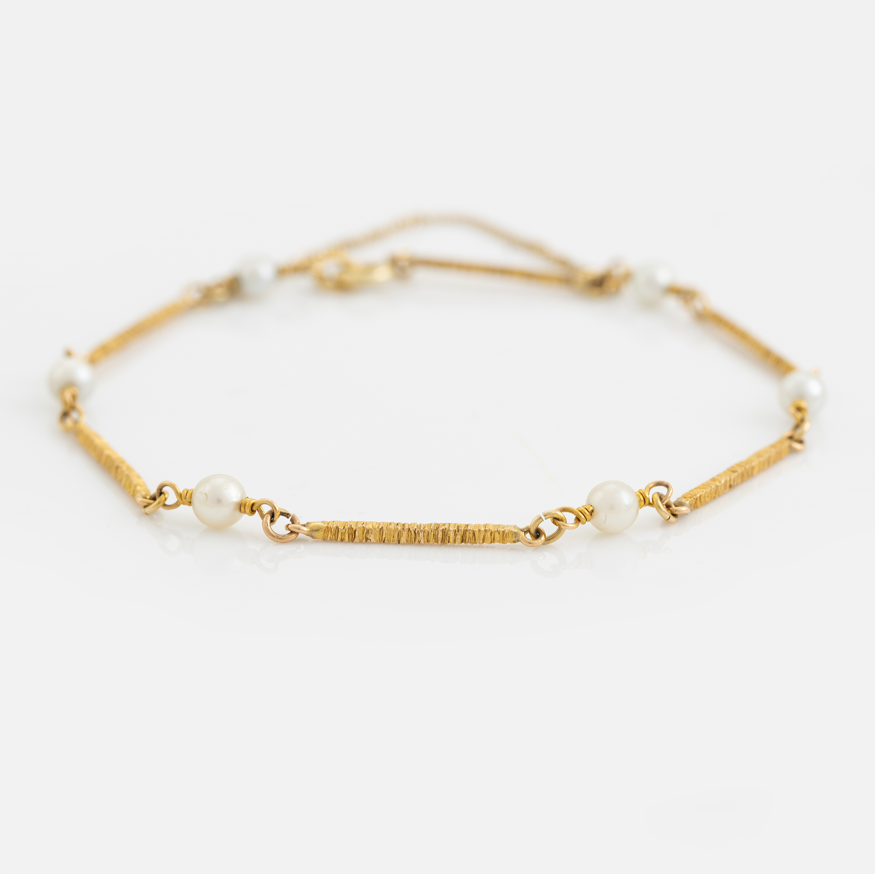 Collier och armband , 14K guld med pärlor, Finska stämplar. - Bukowskis