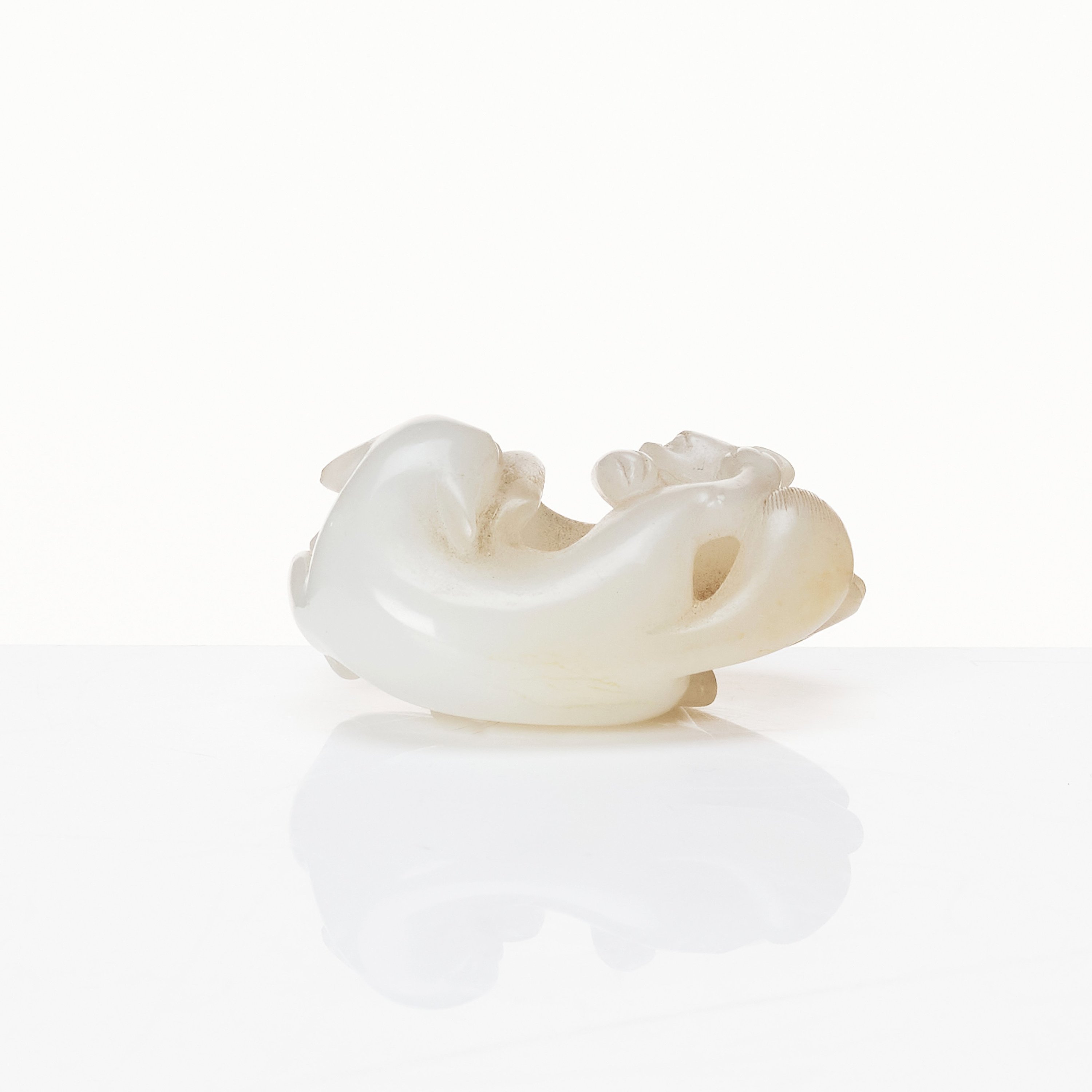 A nephrite figure of two mythical creatures, China, early 20th Century ...