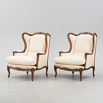 A pair of Rococo style armchairs, first half of the 20th Century ...