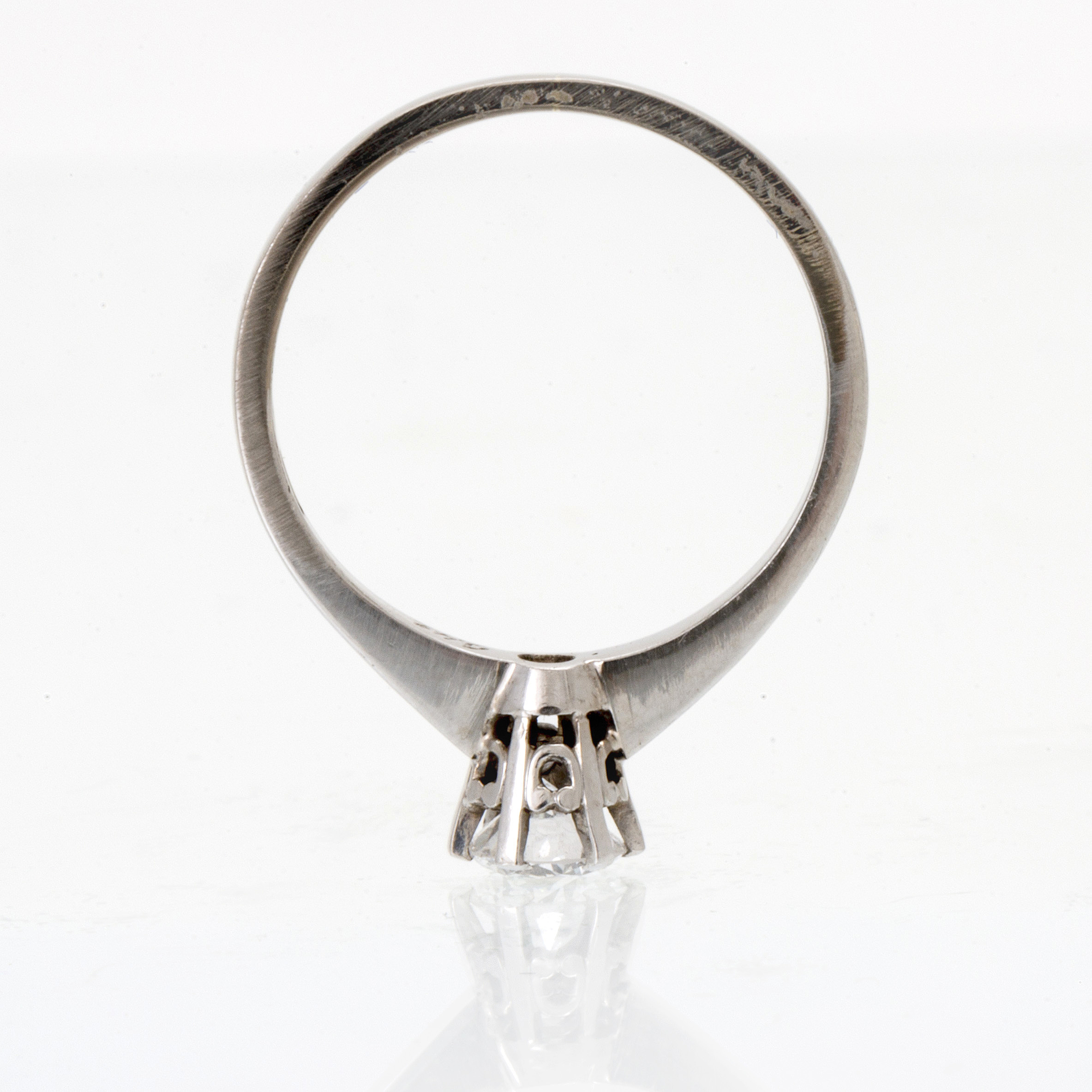An 18K white gold solitaire ring with a brilliant-cut diamond by ...