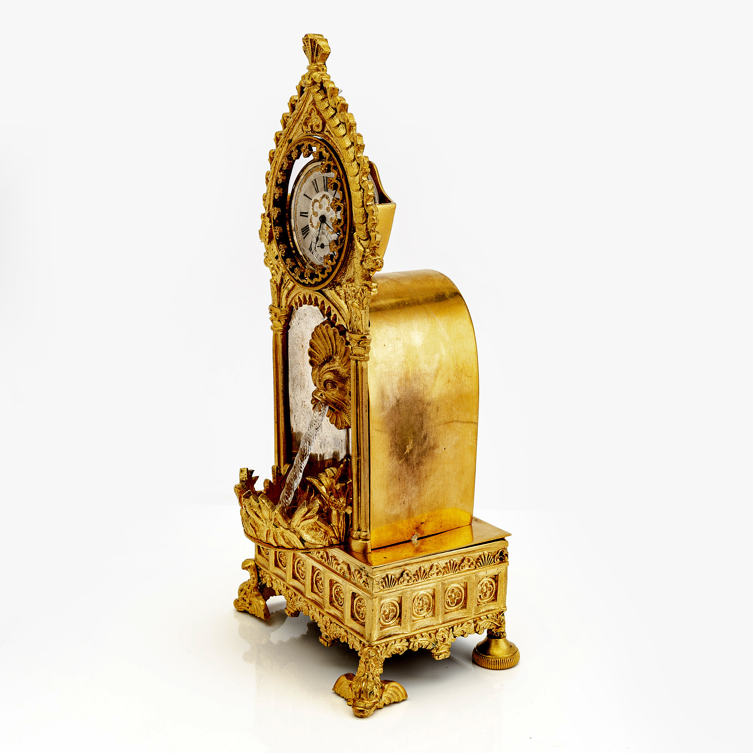 A mid 1800s gilded bronze pocket watch stand and pocket watch. - Bukowskis