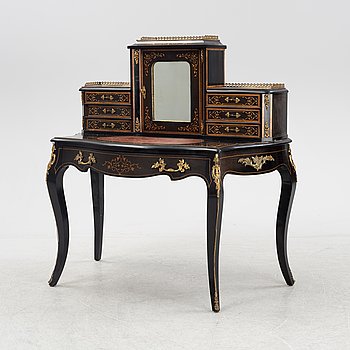 A rococo-style writing desk from the first half of the 20th century ...