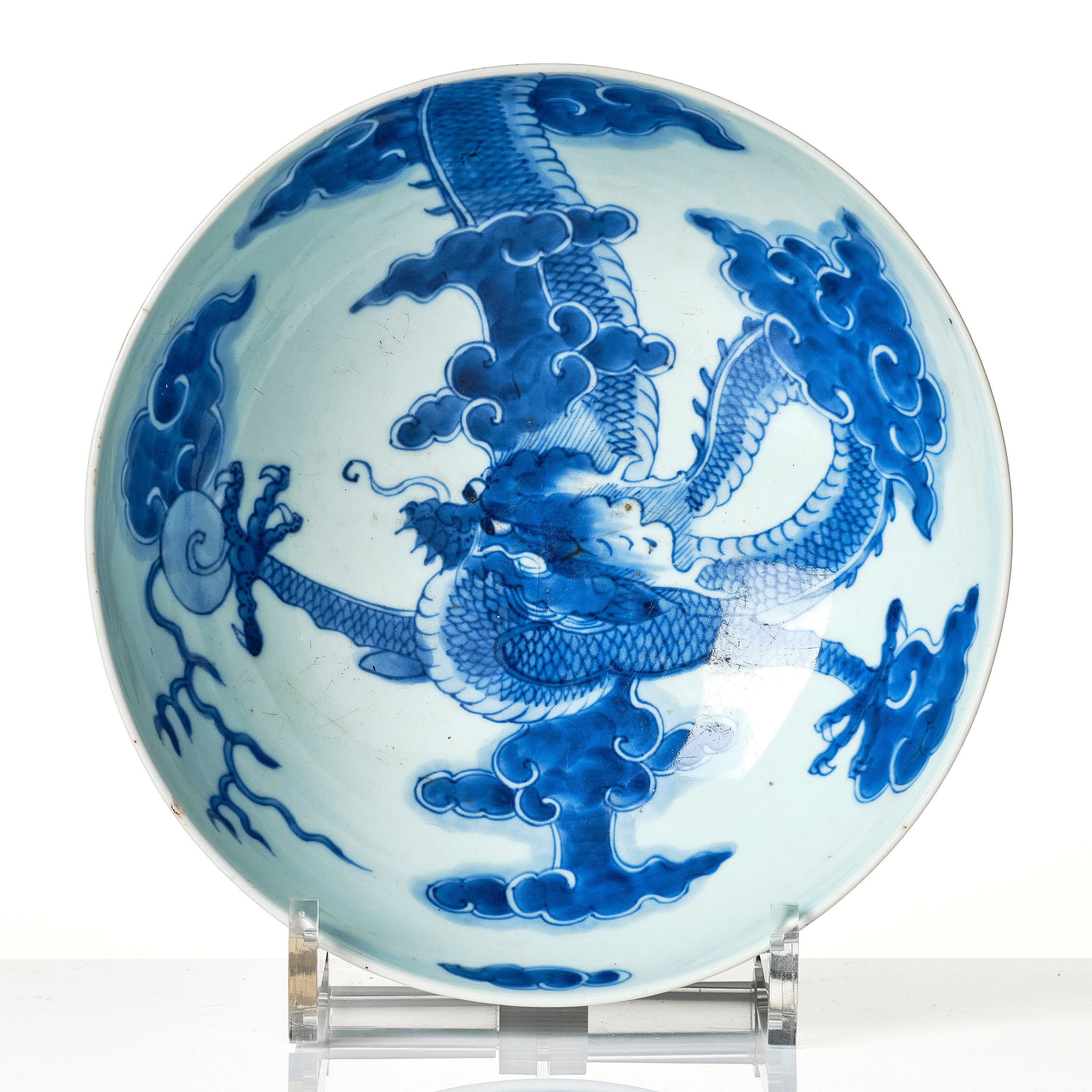 A blue and white four clawed dragon bowl, Qing dynasty, 18th Century ...