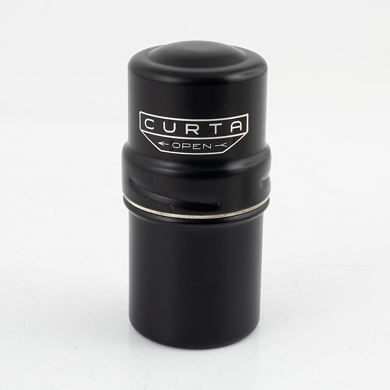 A Curta Type I mechanical calculator. - Bukowskis