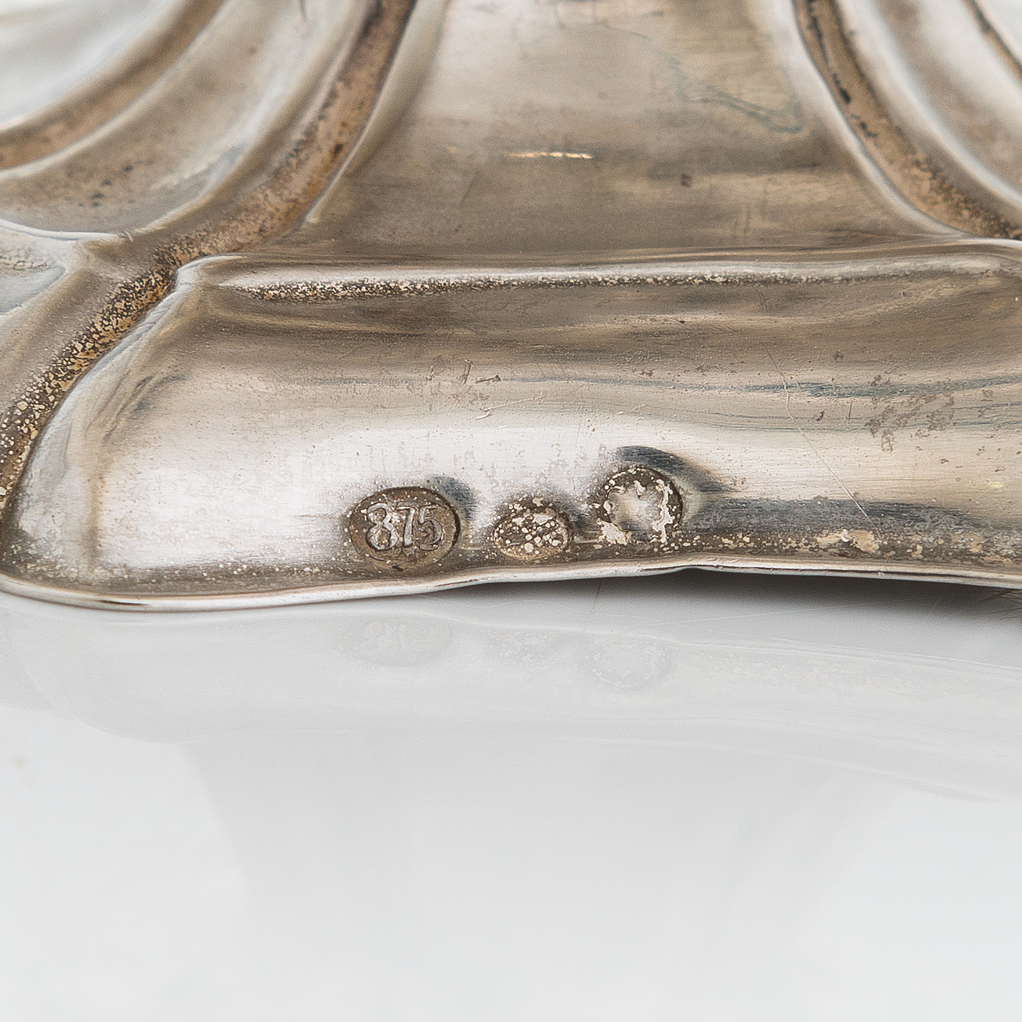 A silver sugar tong by Johan Warjus, and a silver salt cellar by Adolf ...