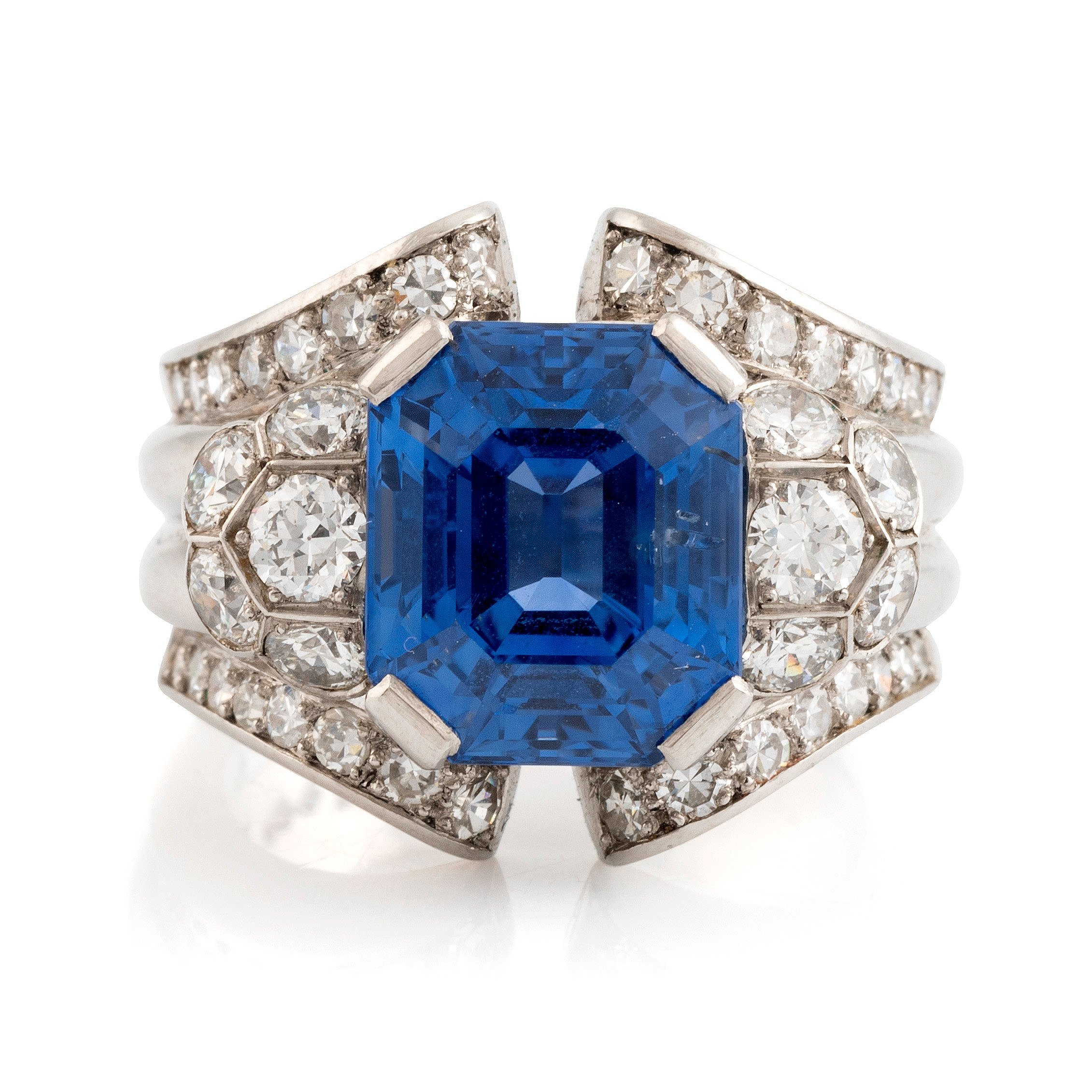 A WA Bolin platinum ring set with a faceted sapphire and old- and eight ...