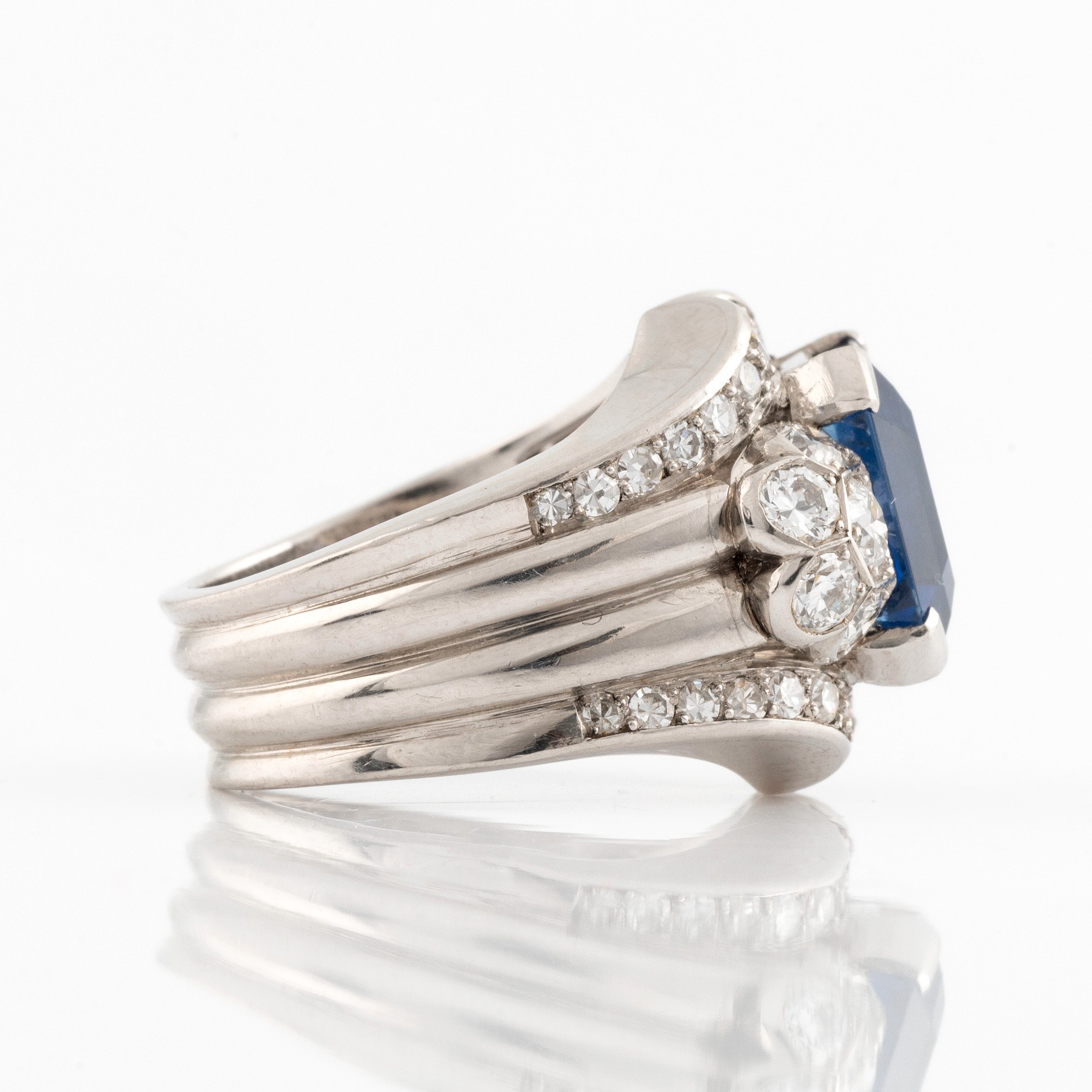 A WA Bolin platinum ring set with a faceted sapphire and old- and eight ...