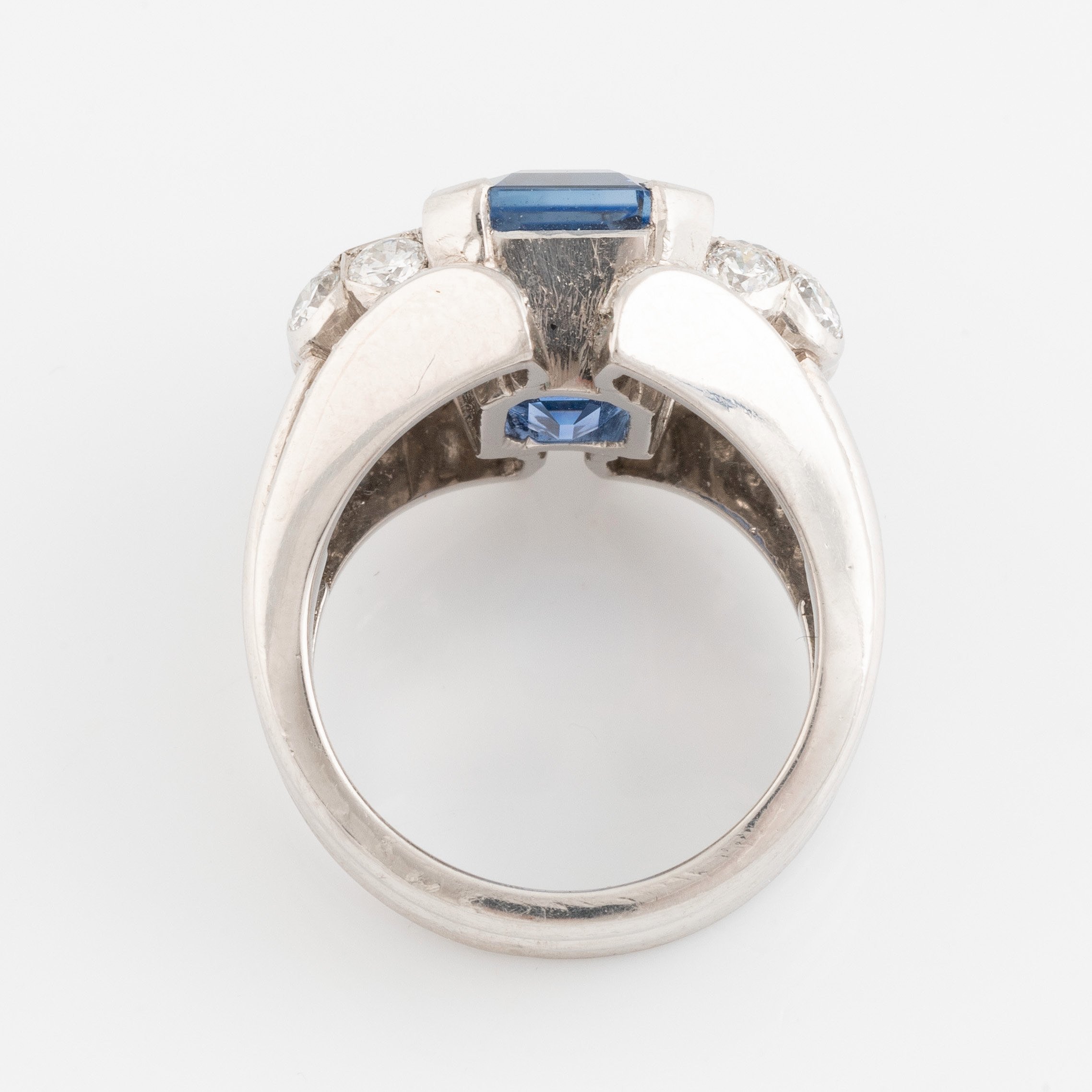 A WA Bolin platinum ring set with a faceted sapphire and old- and eight ...