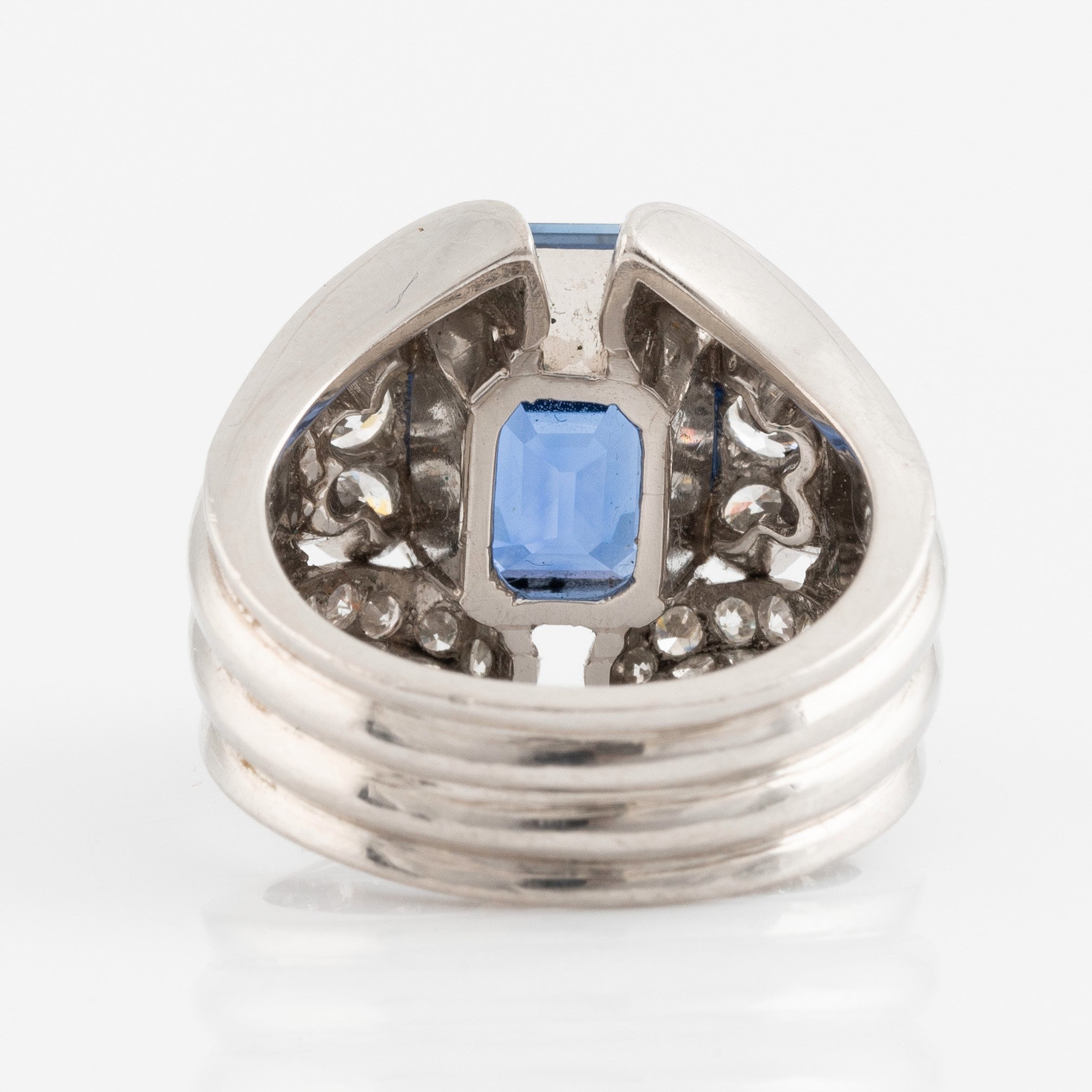 A WA Bolin platinum ring set with a faceted sapphire and old- and eight ...