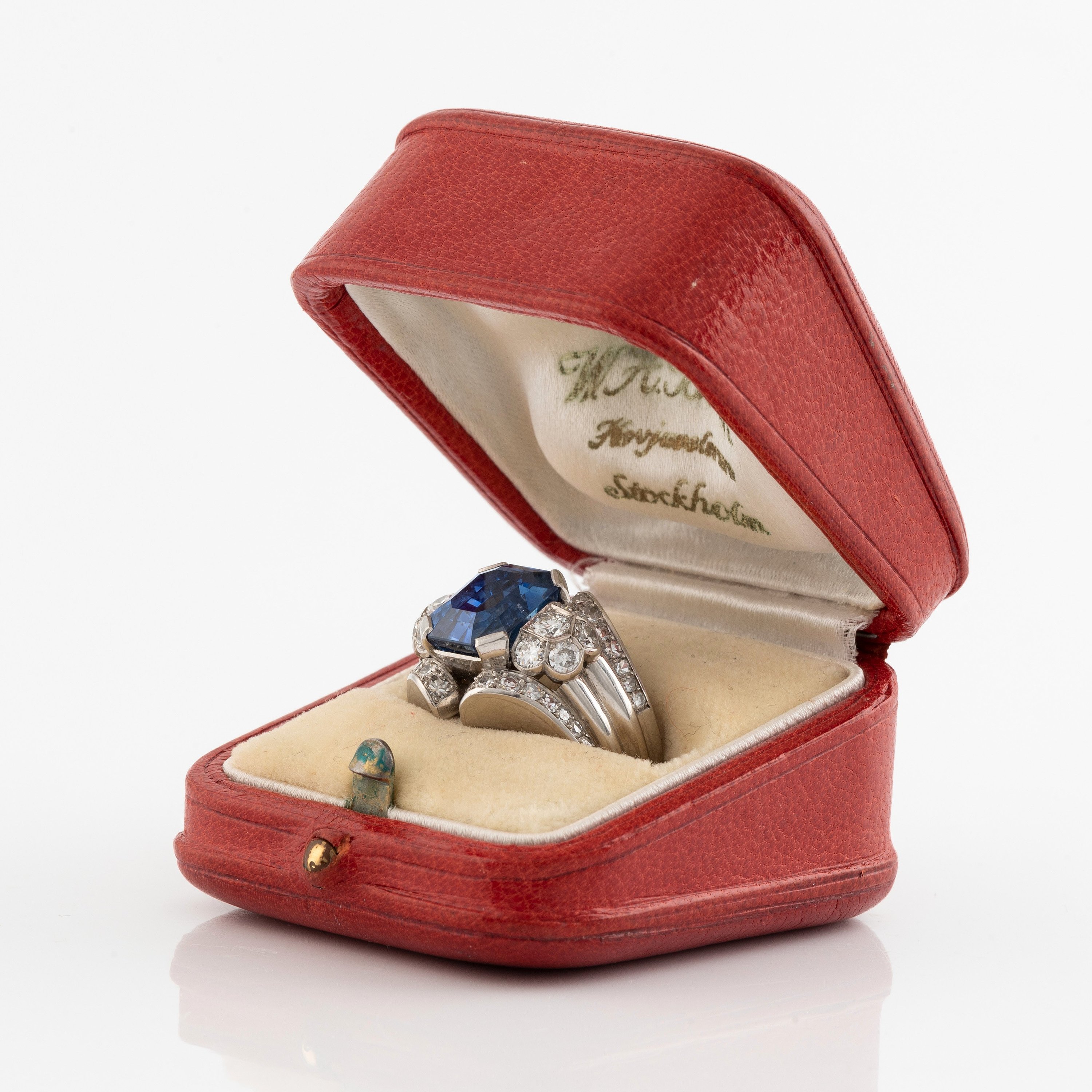 A WA Bolin platinum ring set with a faceted sapphire and old- and eight ...