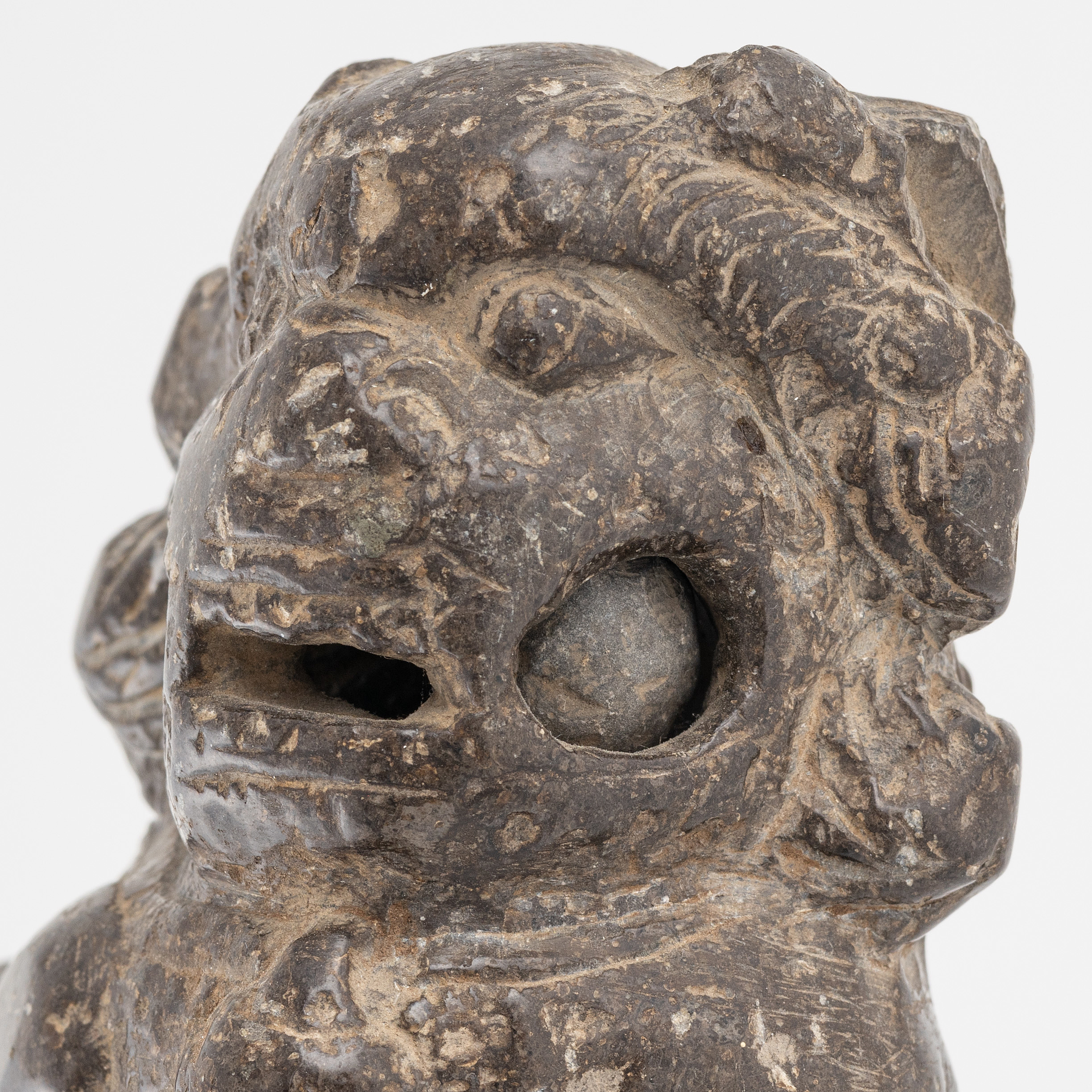 A stone scroll weight/sculpture of a buddhist lion, China, presumably ...