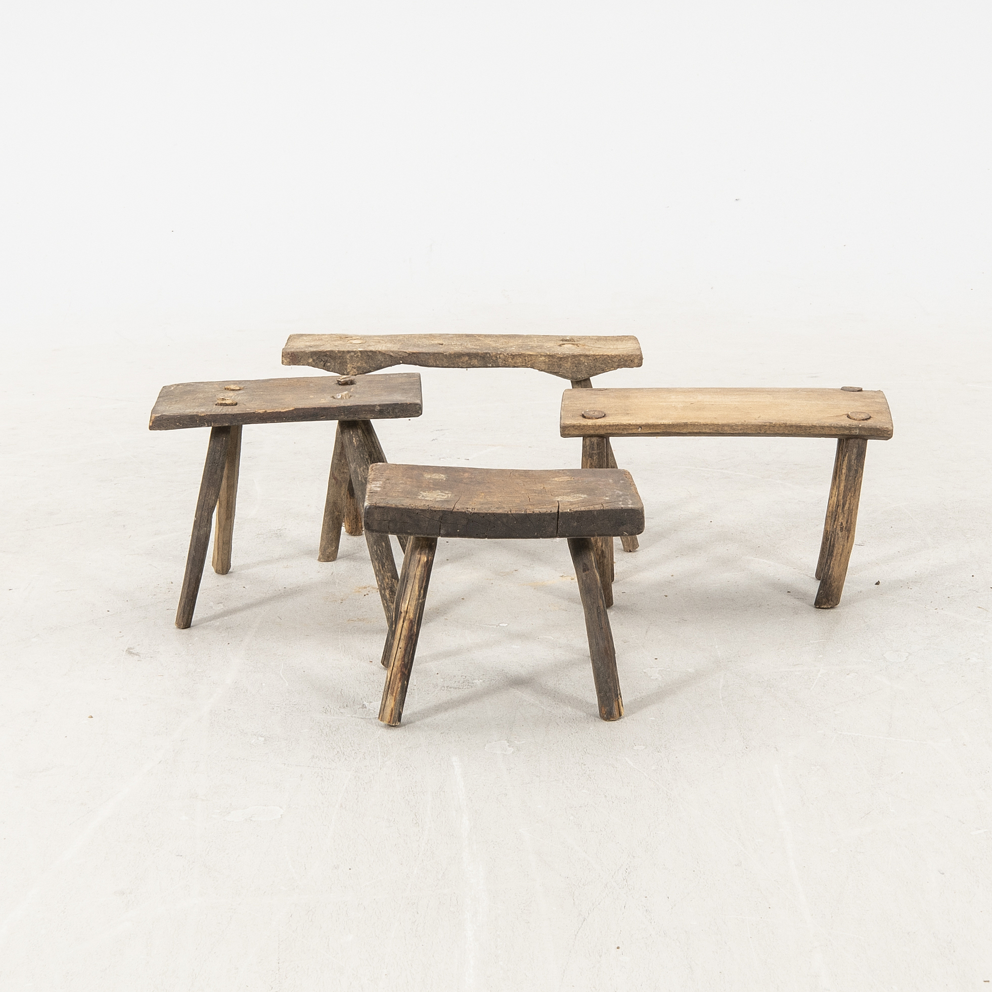 A set of four wooden stools first half of the 20th century. - Bukowskis
