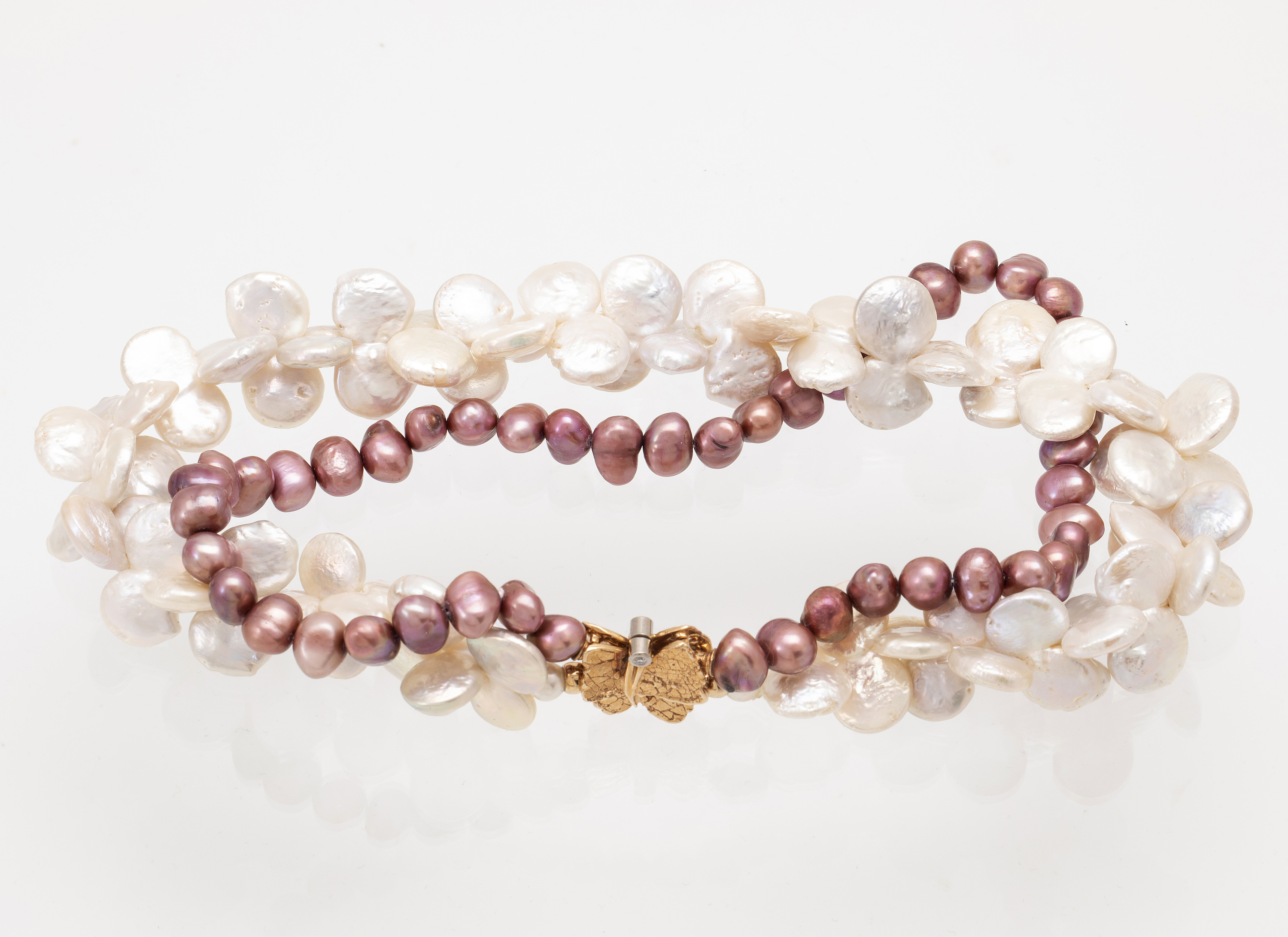 A 14K white and red gold lock with round brilliant cut diamonds and ...