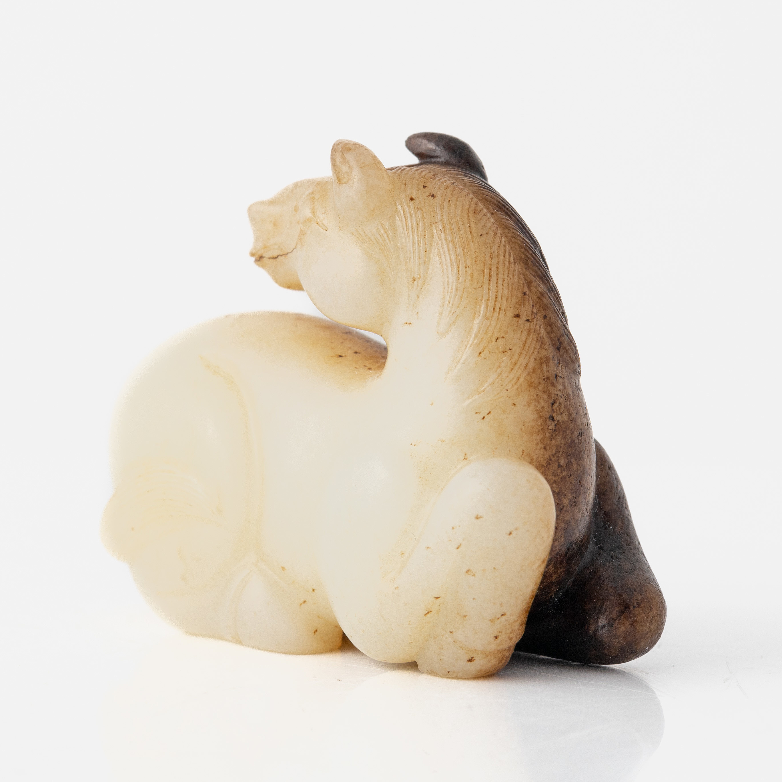 A nephrite sculpture of a horse, China, 20th Century. - Bukowskis