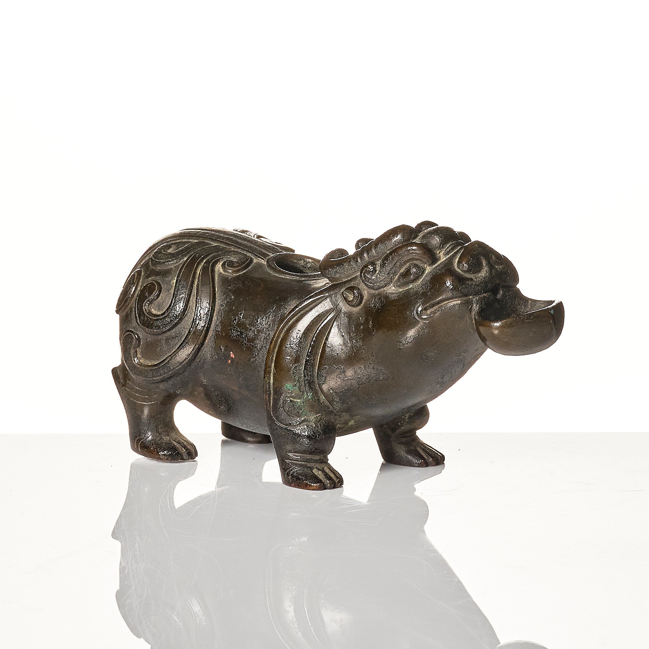 A bronze vessel in the shape of a mythical creature, late Ming dynasty ...