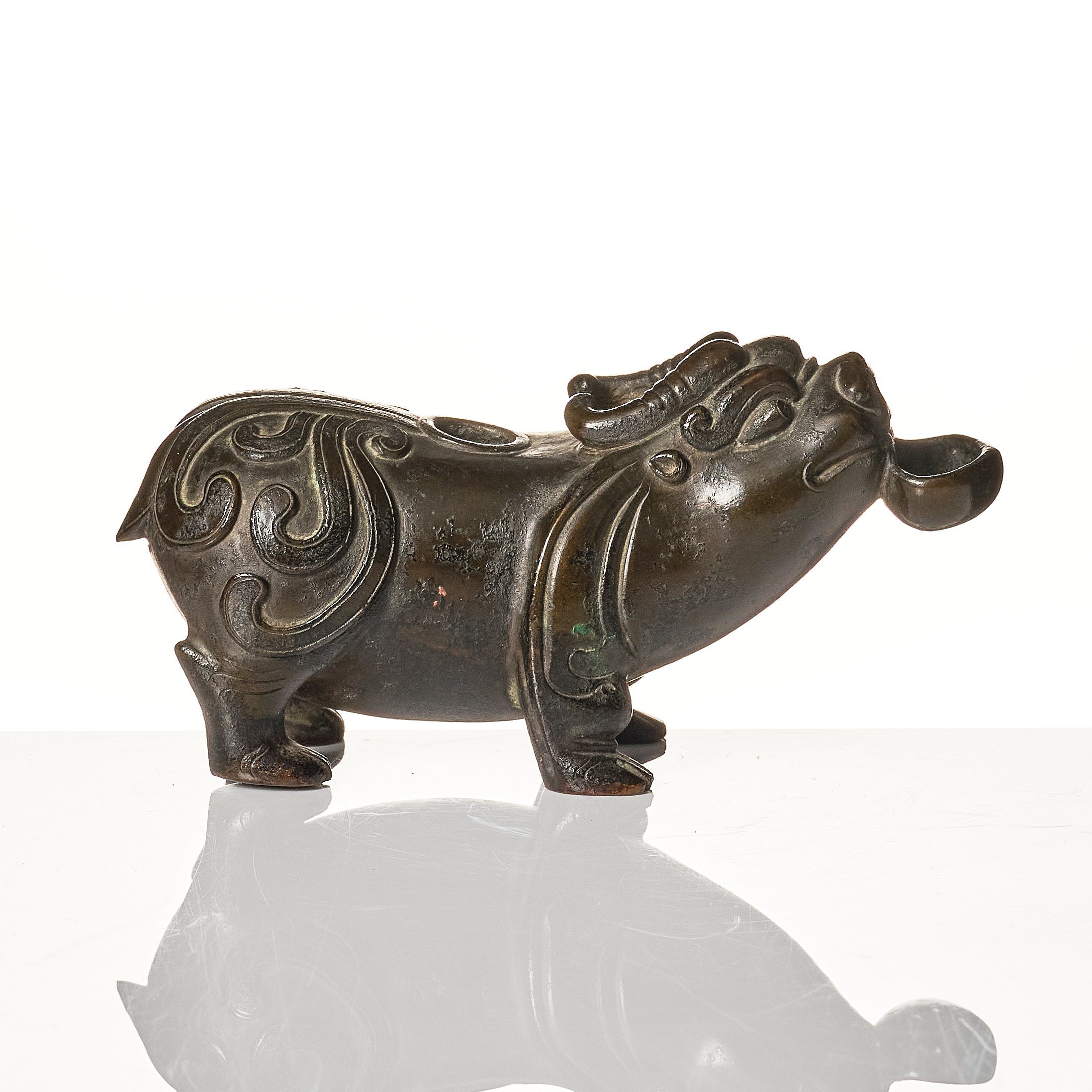 A bronze vessel in the shape of a mythical creature, late Ming dynasty ...