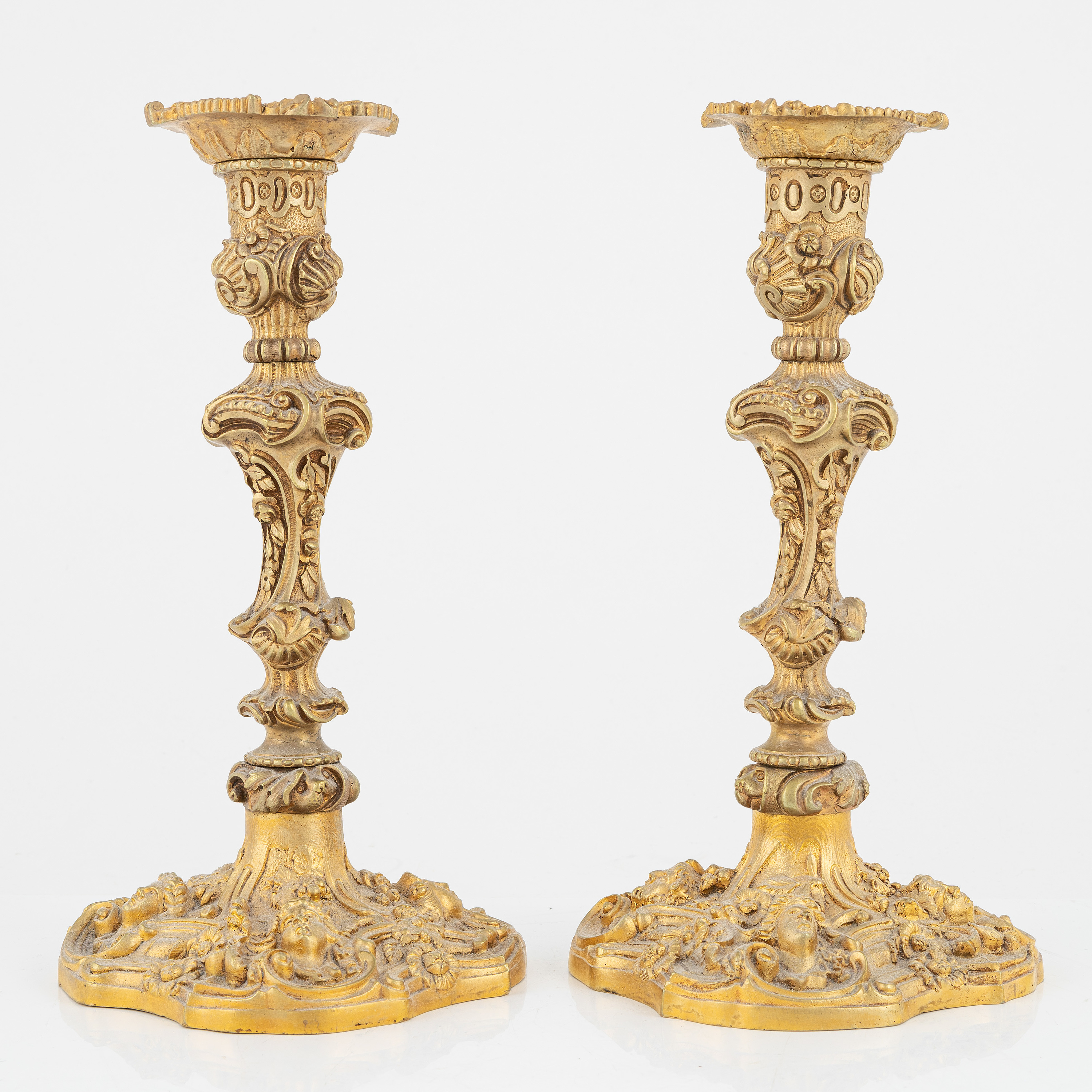 A pair of gilt bronze candle sticks, end of the 19th Century. - Bukowskis