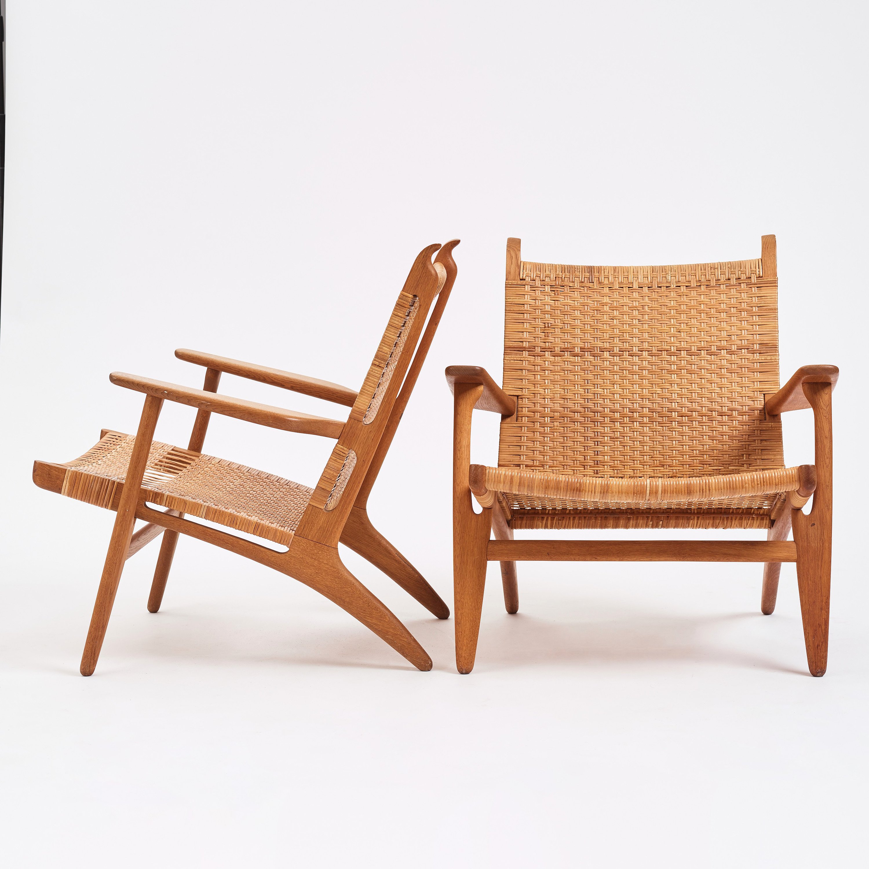 Hans J. Wegner, a pair of oak easy chairs 'CH27', Carl Hansen & Son ...