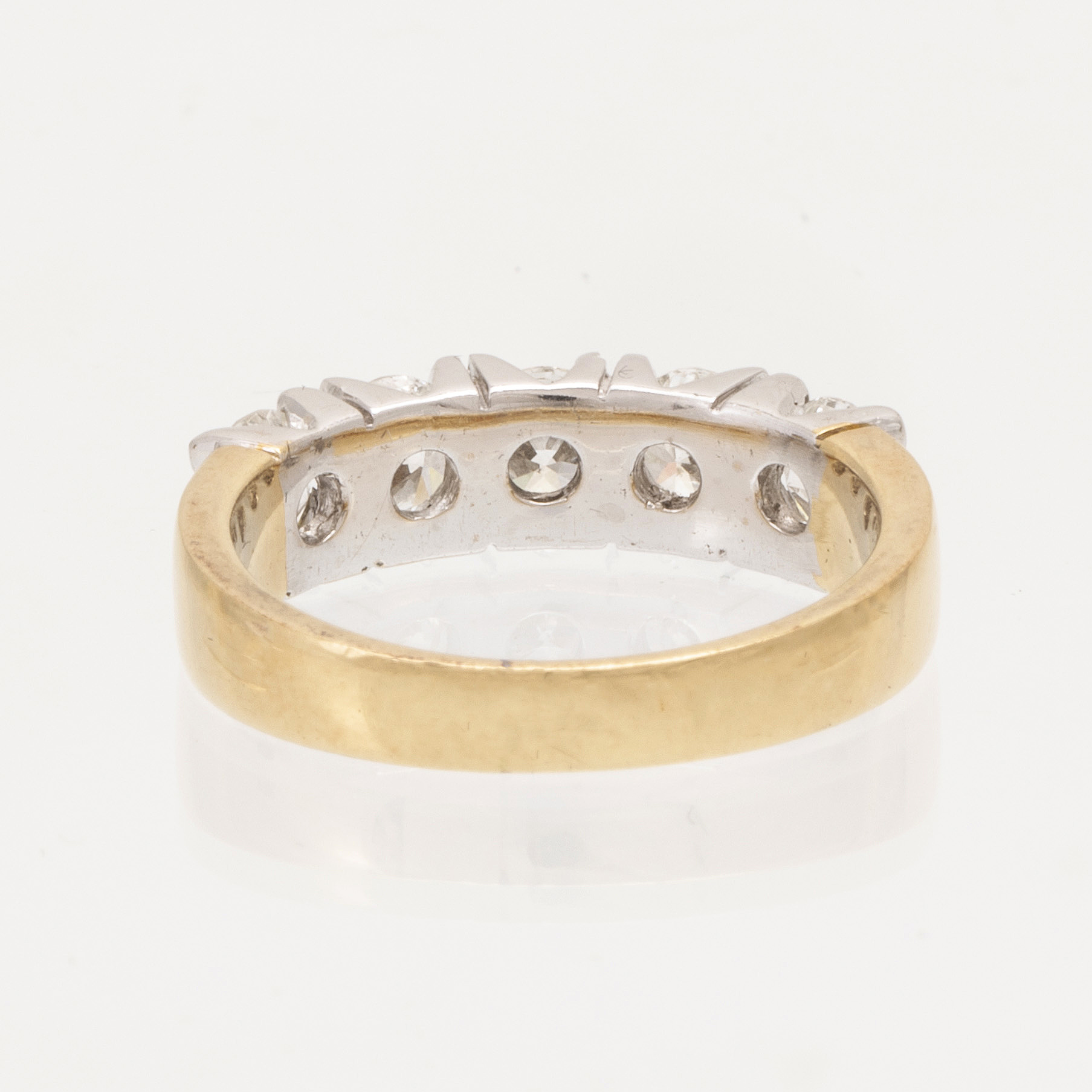 An 18K white and red gold ring set with round brilliant cut diamonds ...