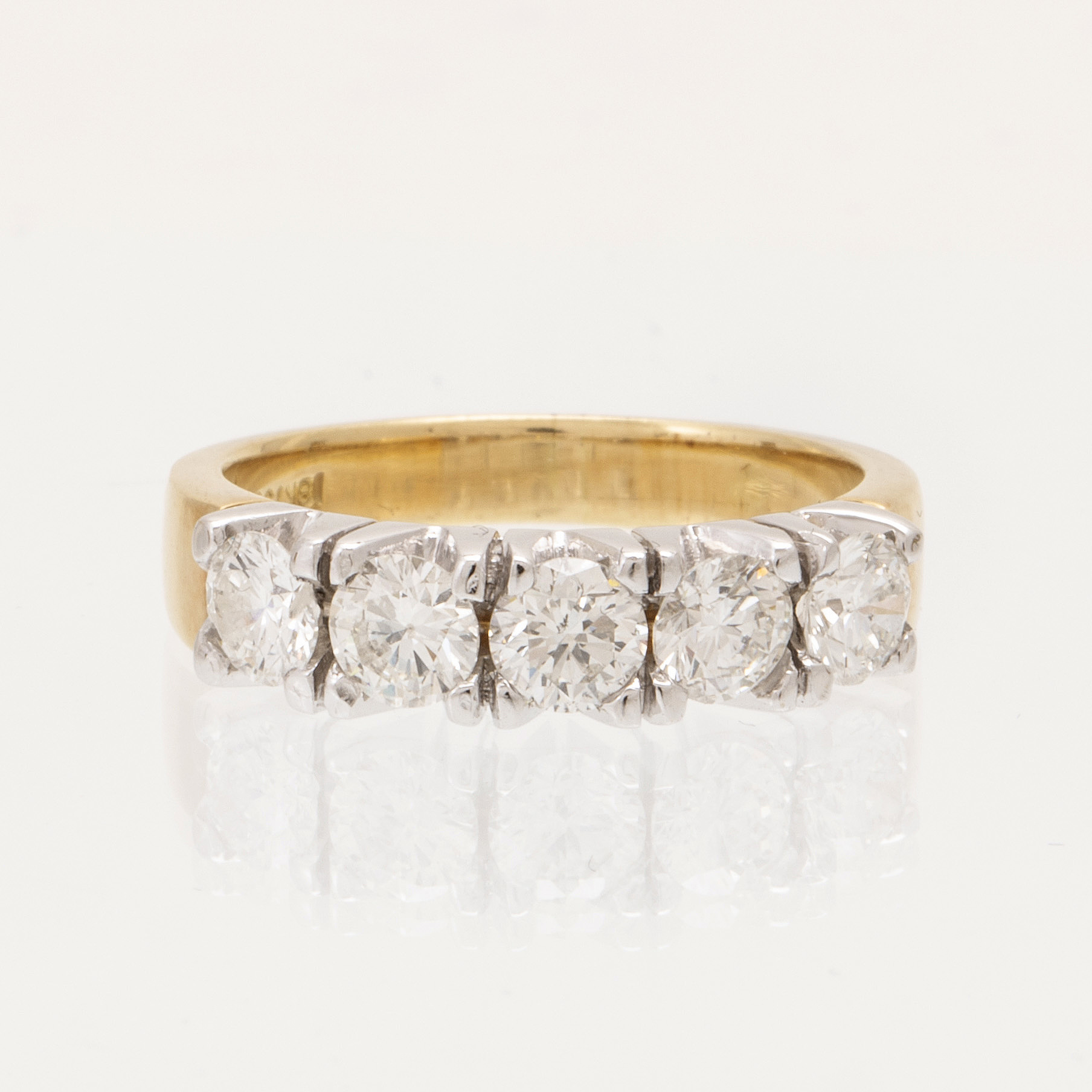 An 18K white and red gold ring set with round brilliant cut diamonds ...