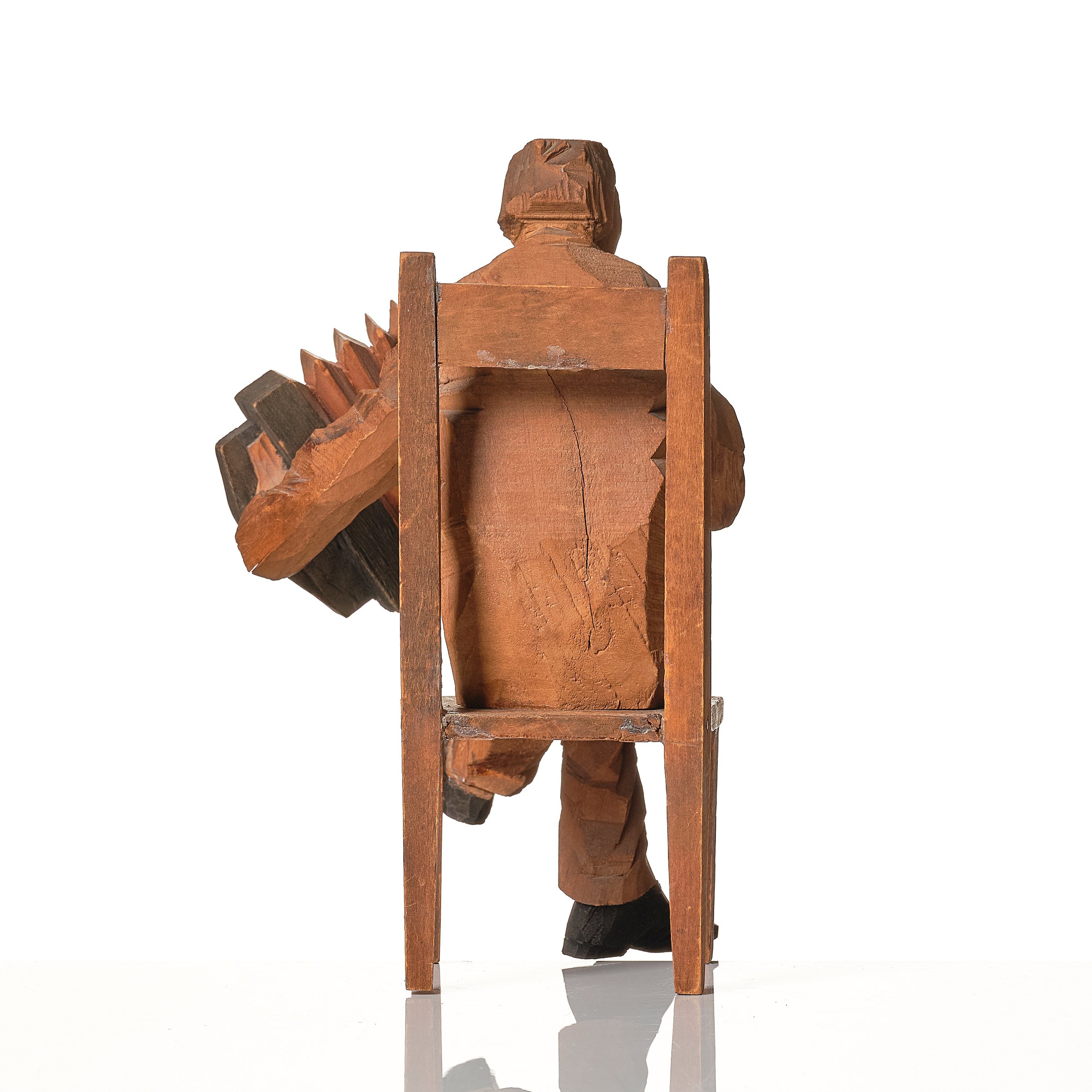 Axel Petersson Döderhultarn, Seated accordionist. - Bukowskis