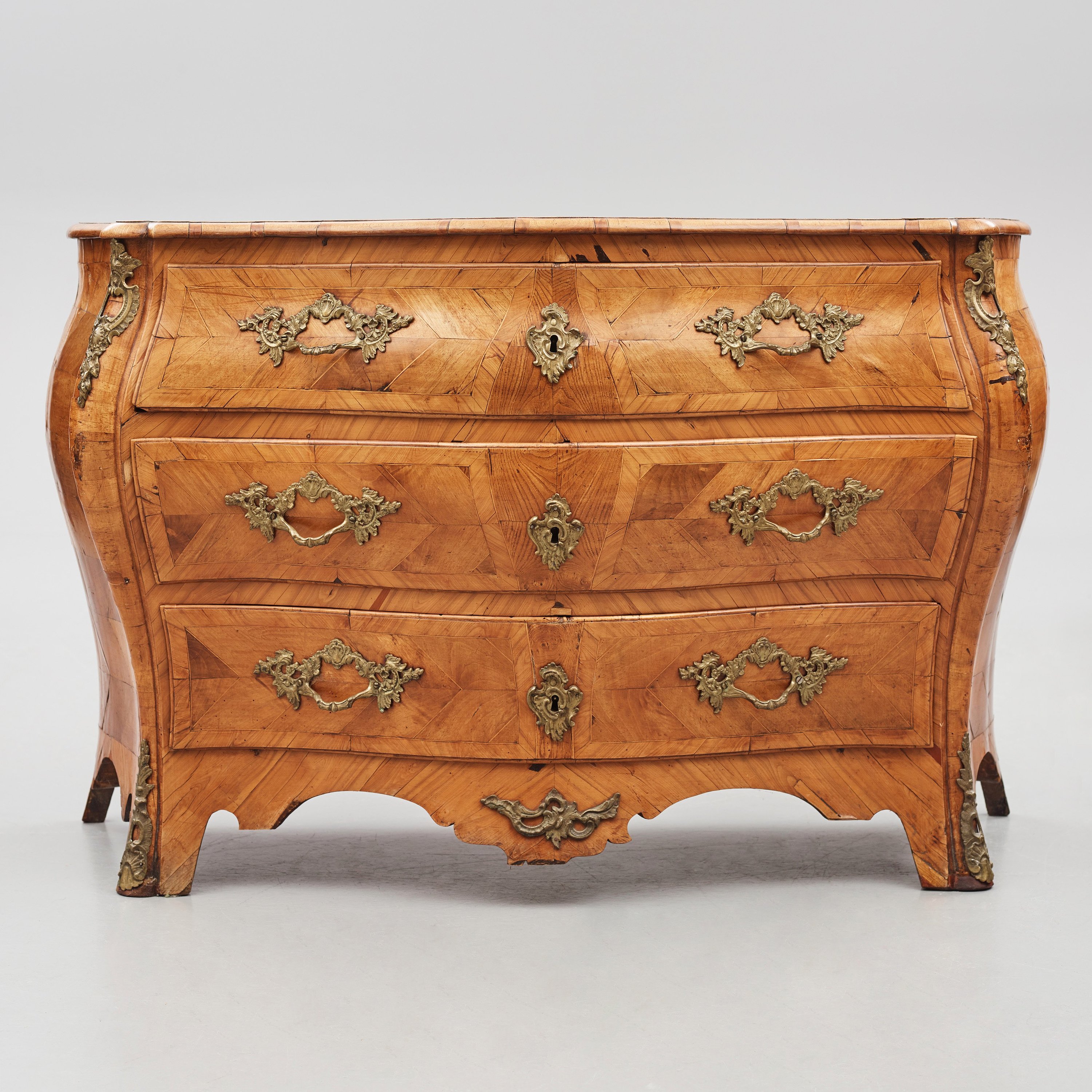 A brass-mounted and marquetry rococo commode, later part of the 18th ...
