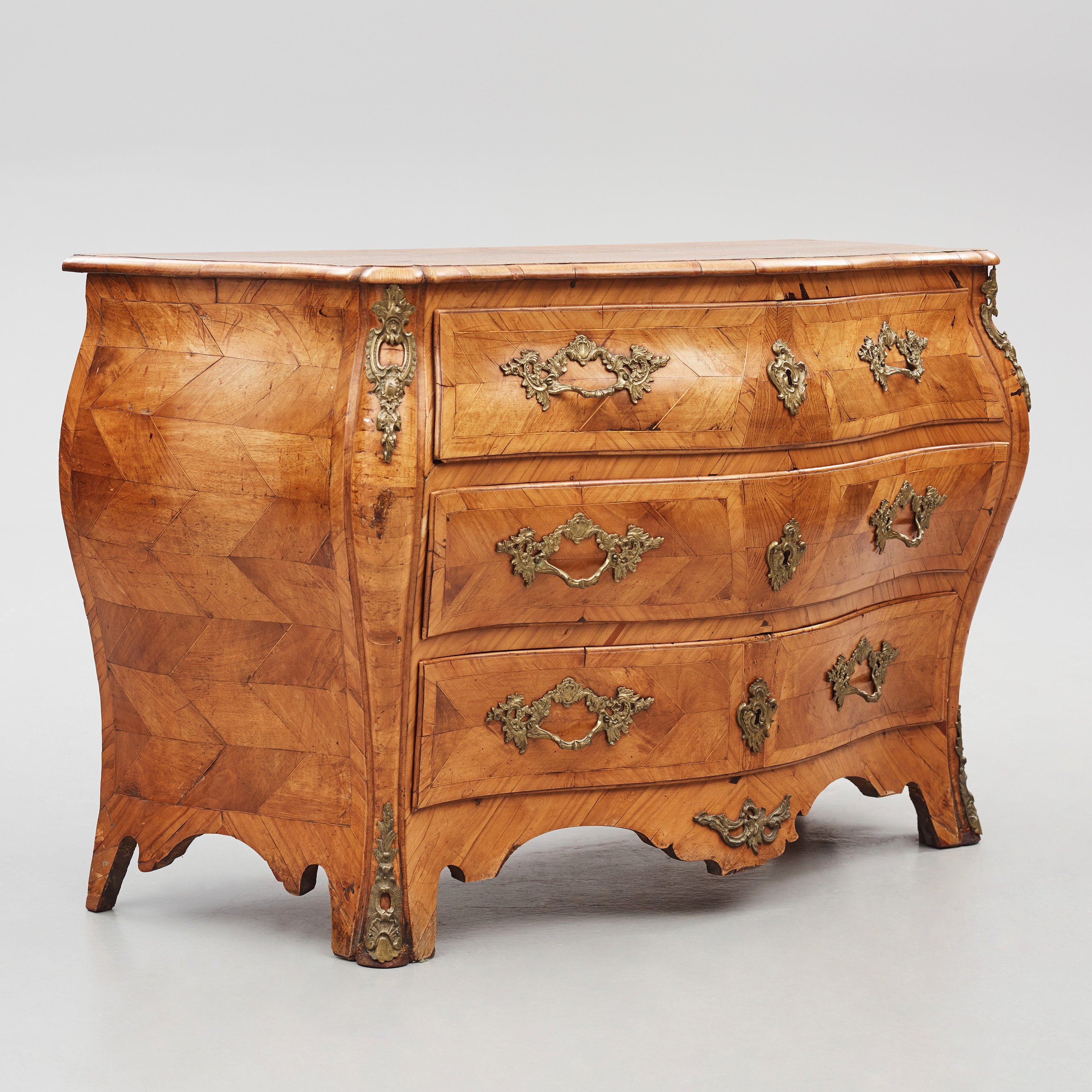 A brass-mounted and marquetry rococo commode, later part of the 18th ...