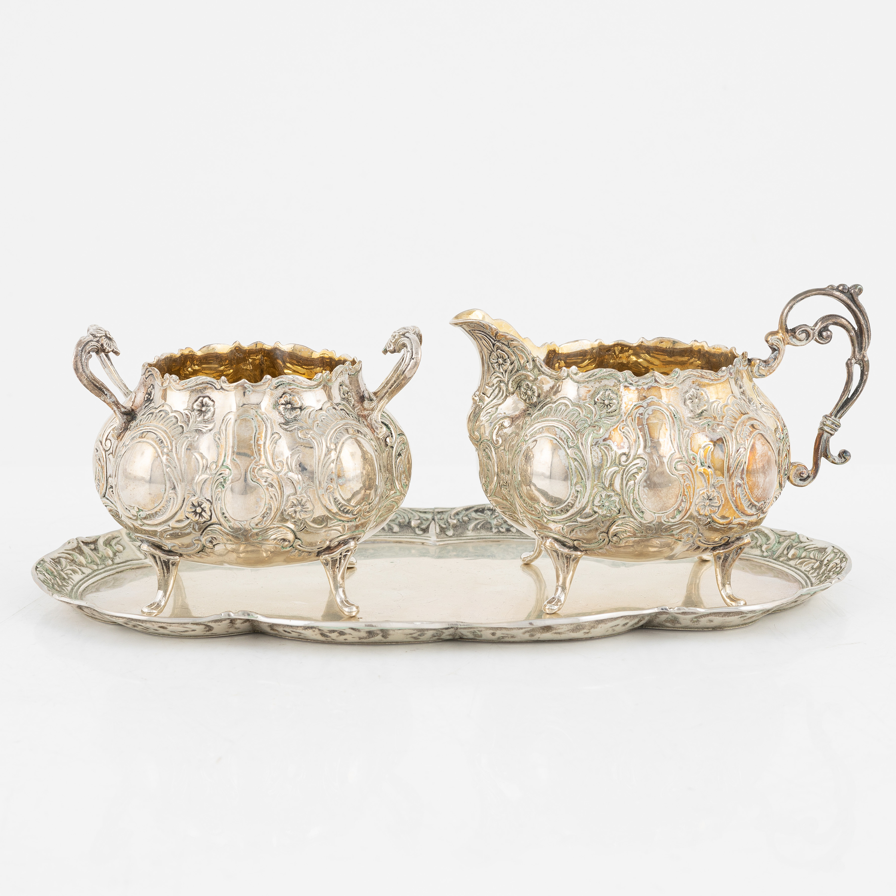 A silver Rococo style creamer, sugar bowl and tray, Gewe ...