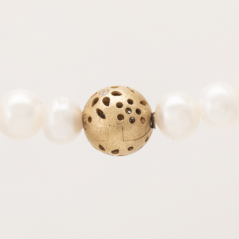 Ole Lynggaard, lås "Lace" 18K guld med briljantslipade diamanter samt ...