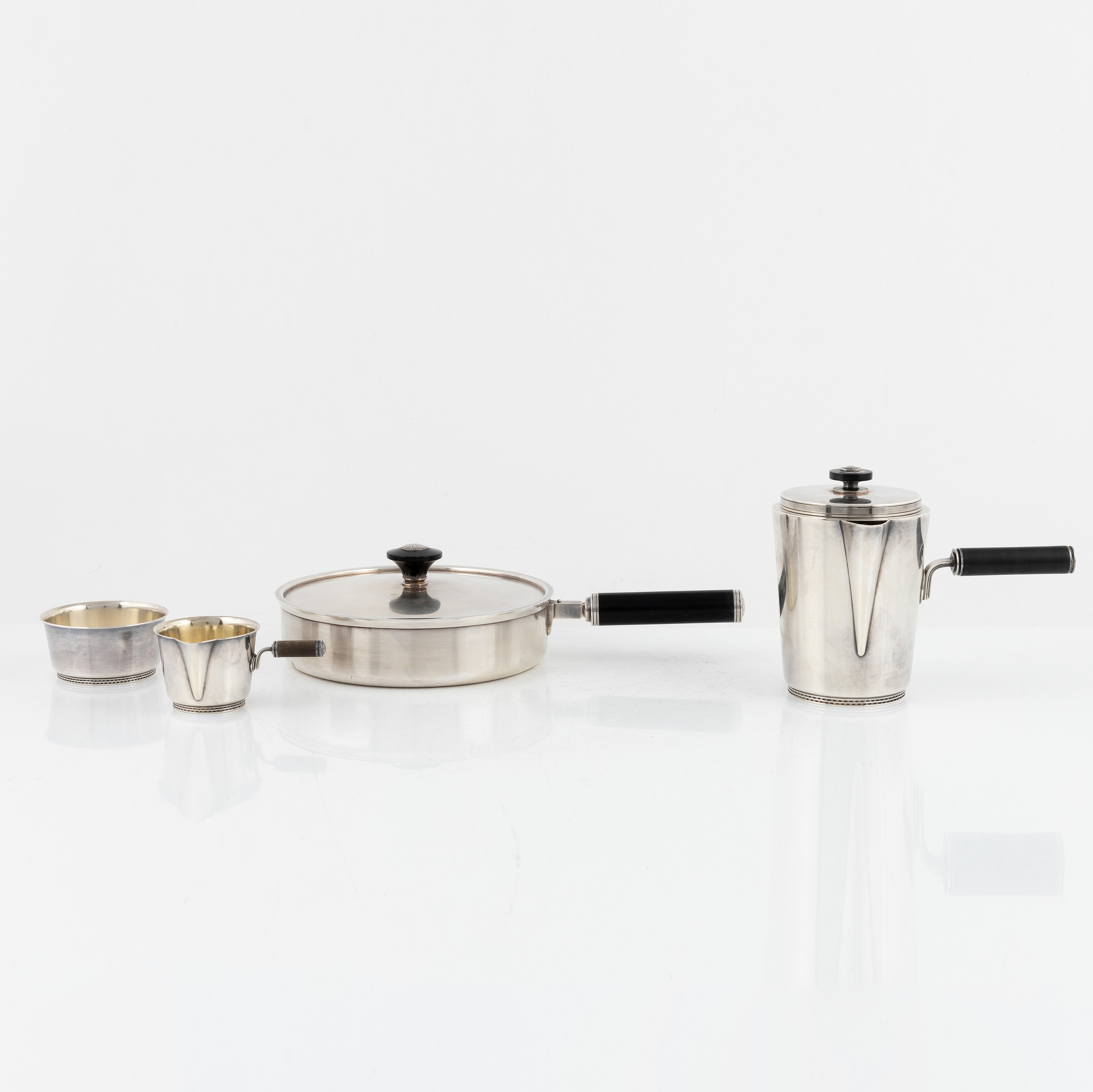 Erik Fleming, a 3-piece silver plated coffee service and a lidded dish ...