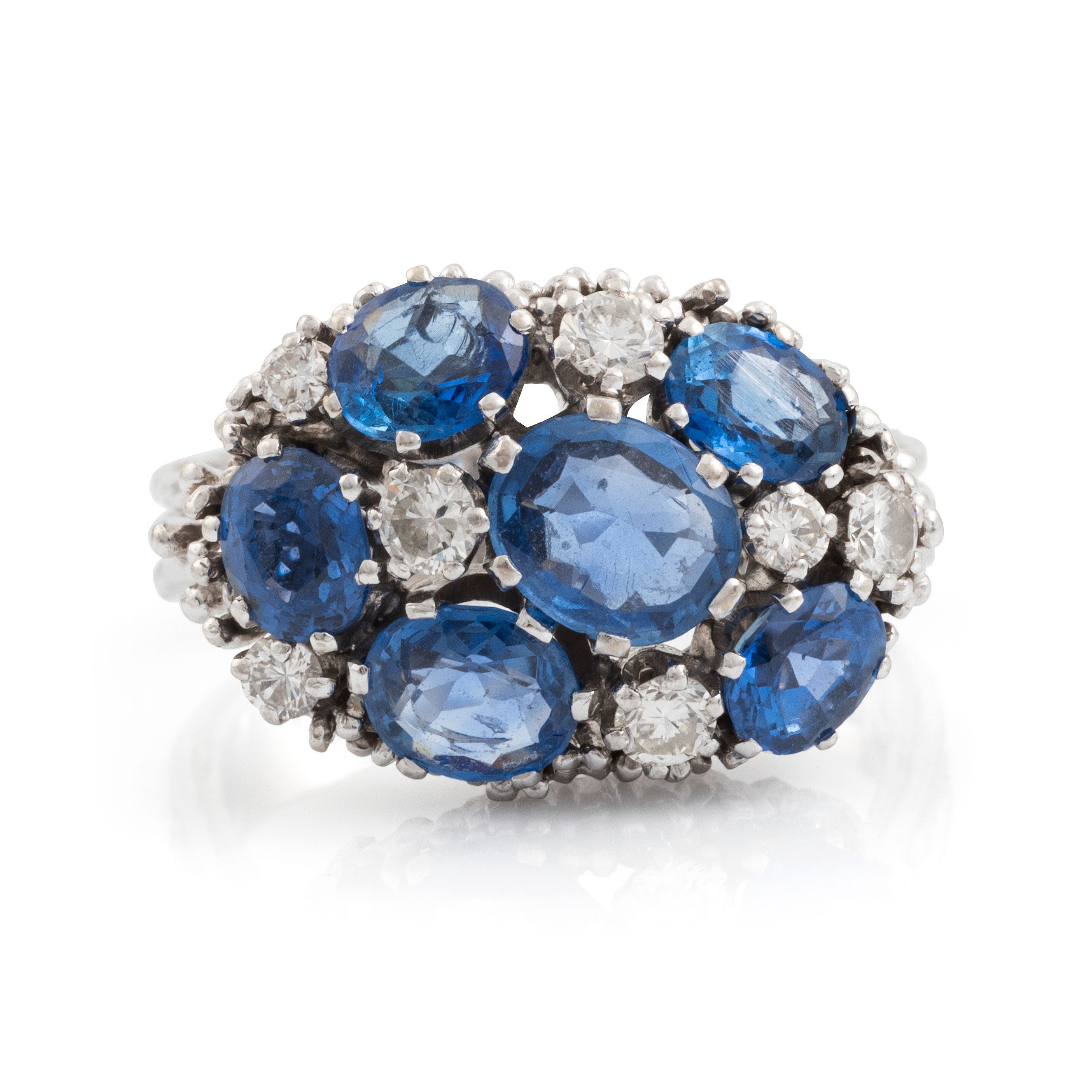 A WA Bolin ring in 18K white gold set with sapphires and round ...