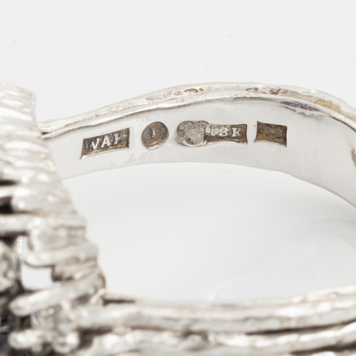 A WA Bolin ring in 18K white gold set with sapphires and round ...