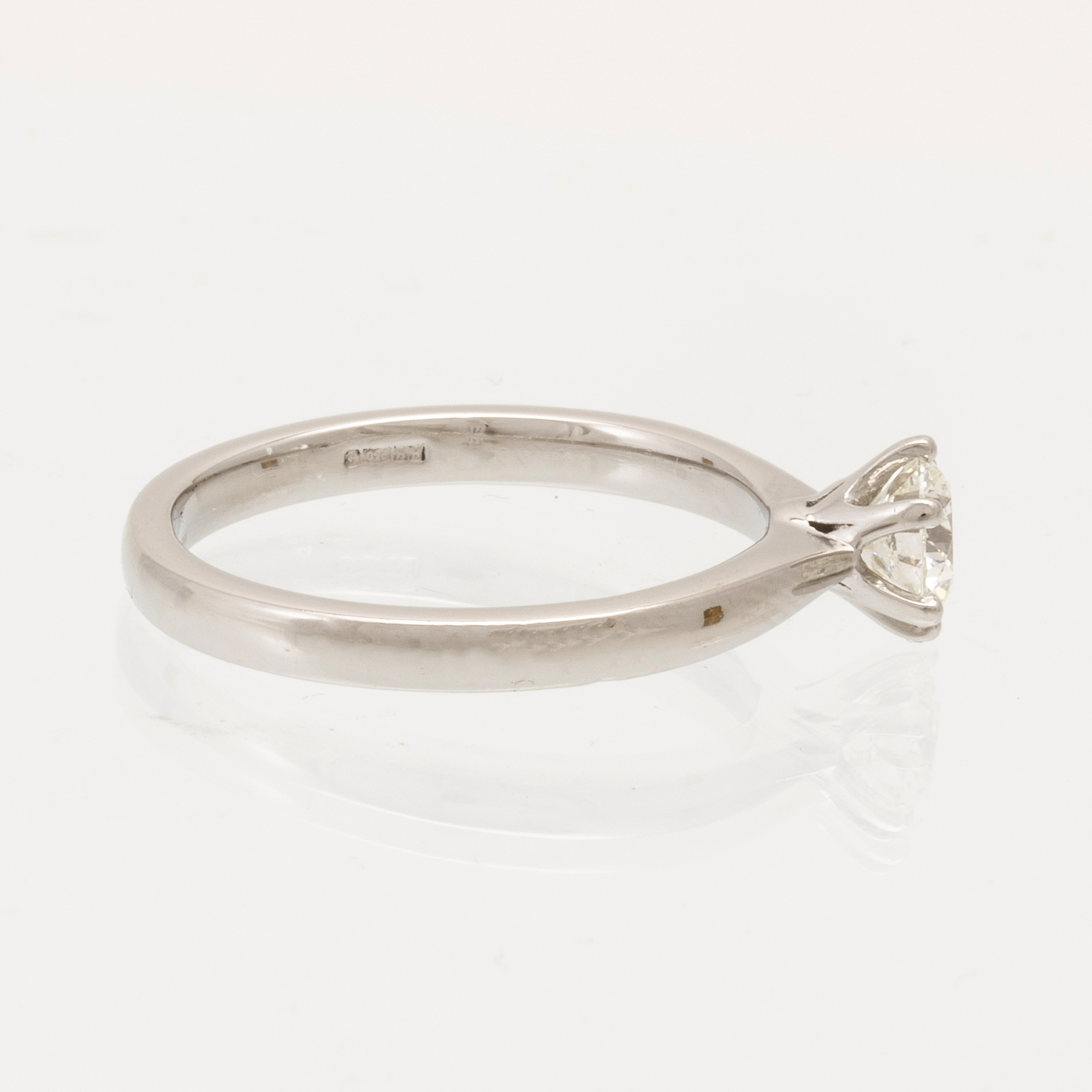 A 950 platinum solitaire ring set with a round brilliant cut diamond ...
