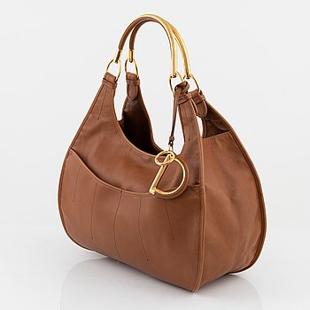 Christian Dior, a brown leather handbag. - Bukowskis