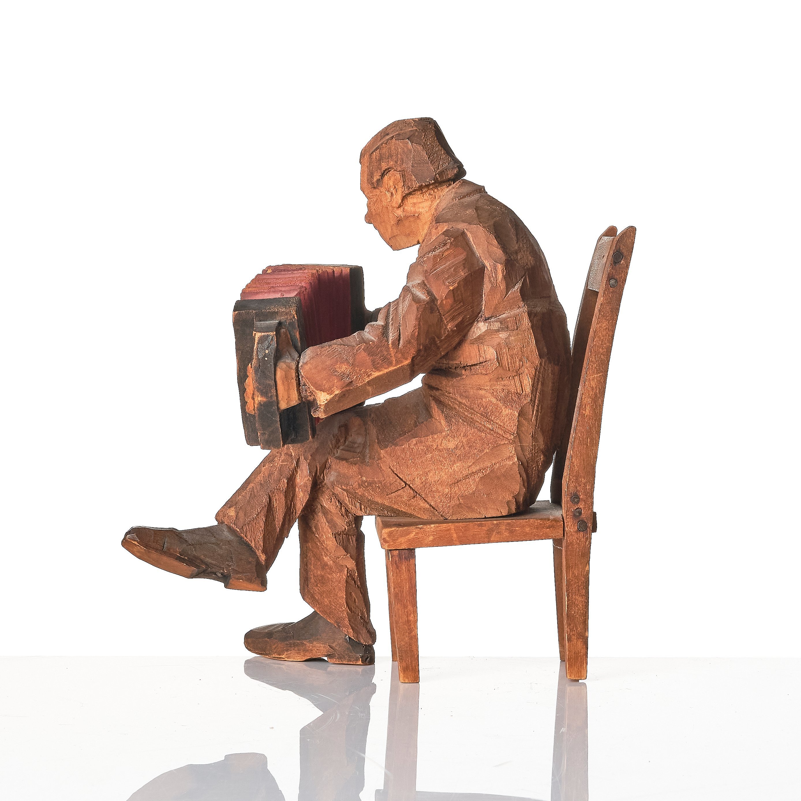 Axel Petersson Döderhultarn, Seated accordionist. - Bukowskis