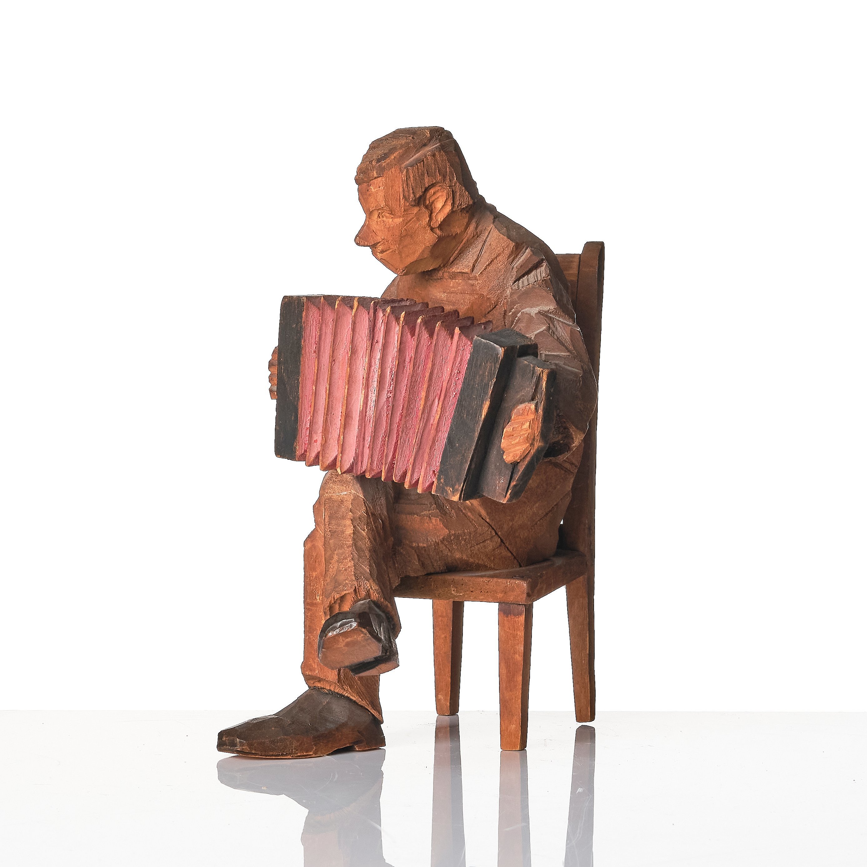 Axel Petersson Döderhultarn, Seated accordionist. - Bukowskis