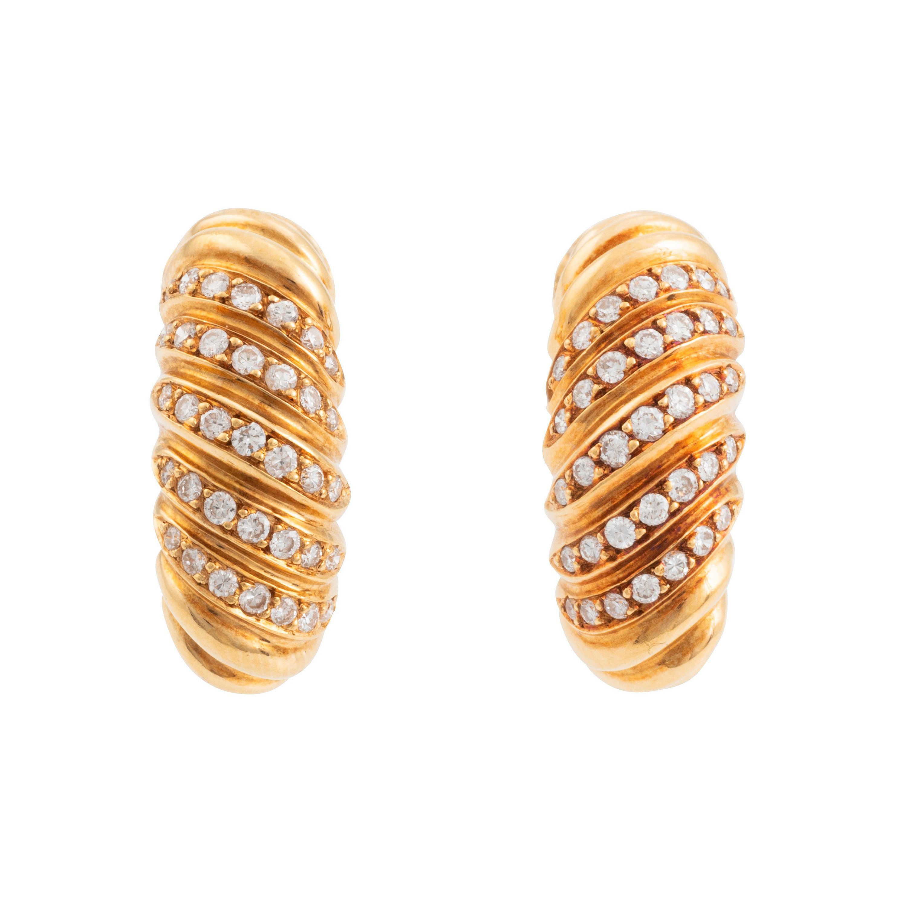 A pair of Cartier earrings in 18K gold set with round brilliant-cut ...