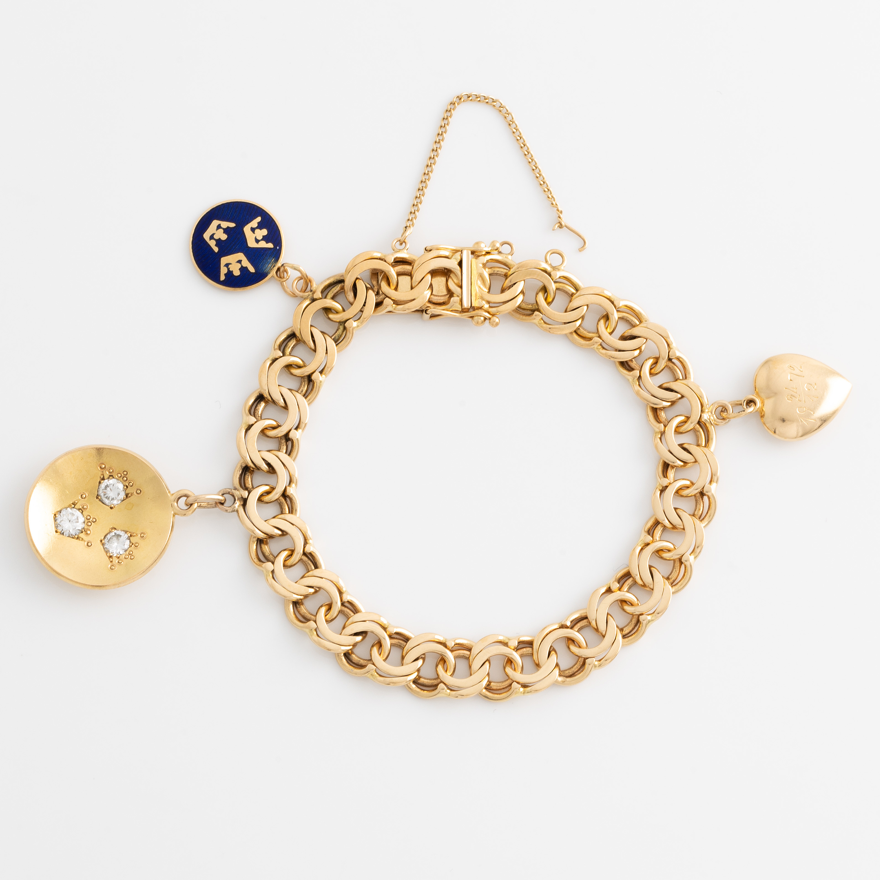 An 18K gold charm bracelet, one charm set with round brilliant-cut ...