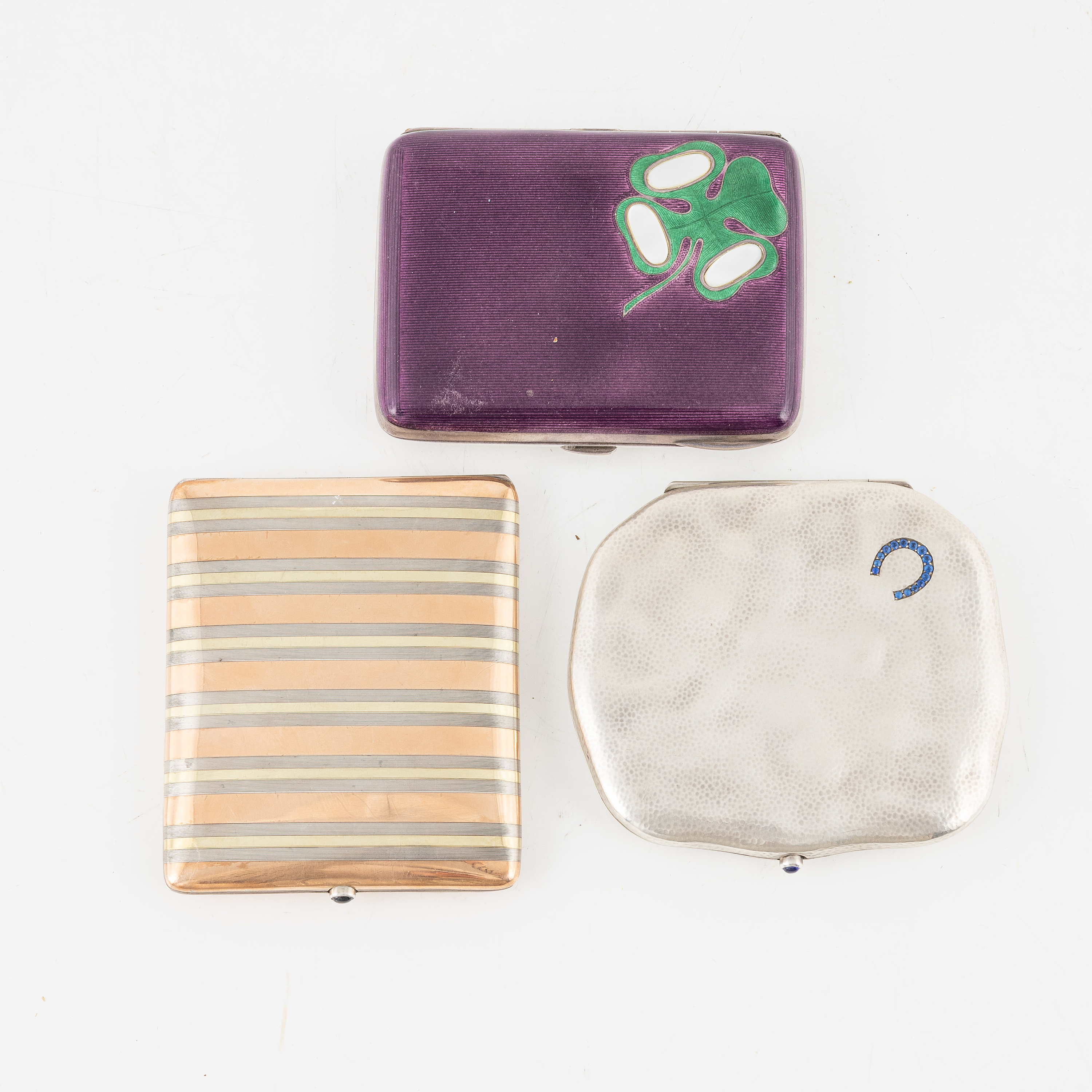 Three ciggarette cases, 20th Century part silver and enamel. - Bukowskis