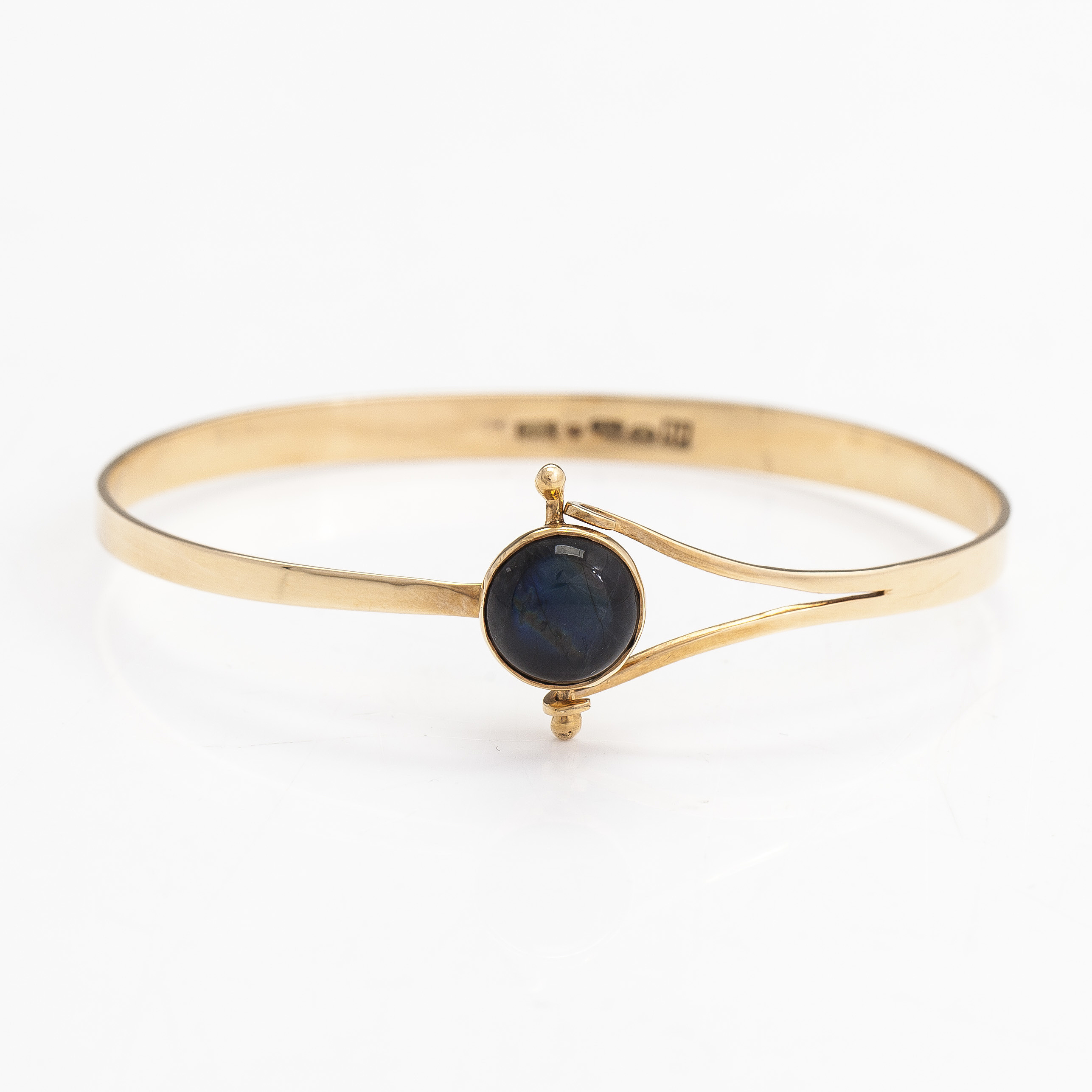 A 14K gold bracelet with a spectrolite for Kaunis Koru, Helsinki 1979 ...