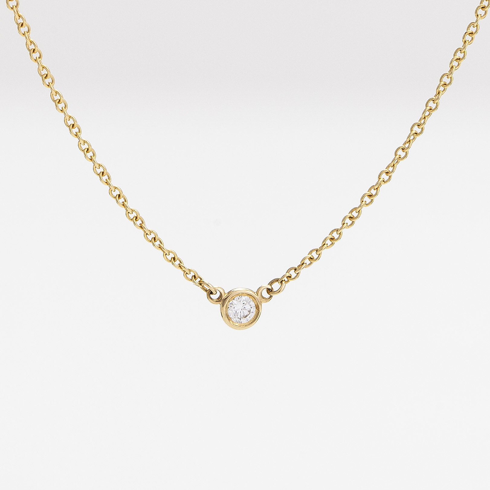 Tiffany & Co, Elsa Peretti, halsband, 18K guld och diamant ca 0.05 ct. - Bukowskis